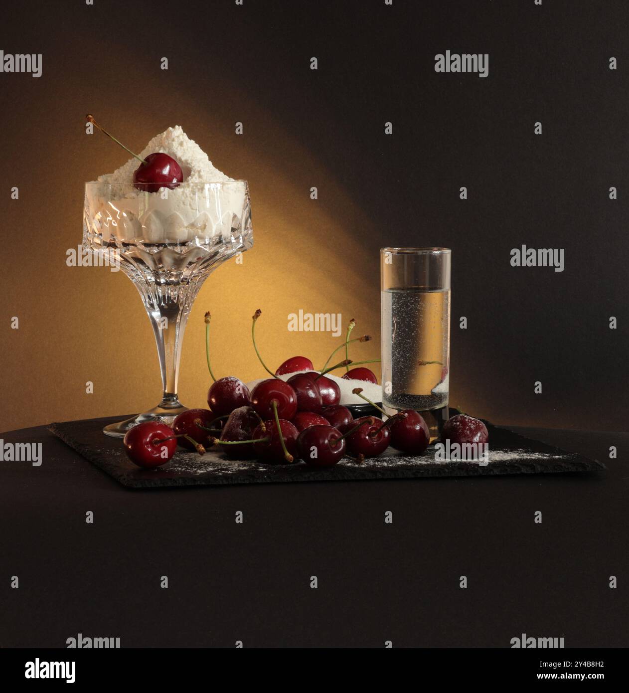 Ingredients for Ukrainian dumplings: flour in a glass bowl, cherries ...