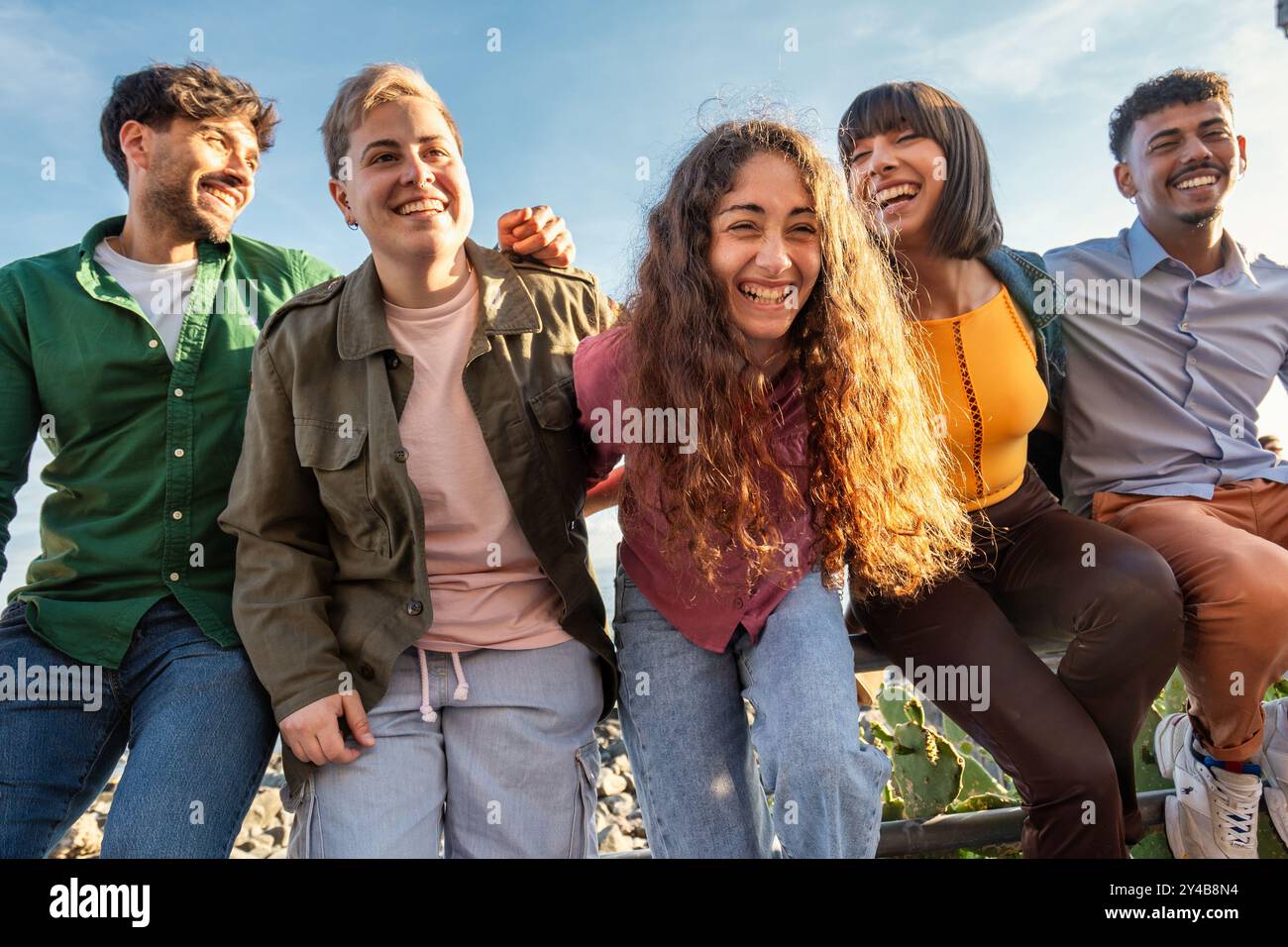 Authentic capture of multicultural young adults enjoying a carefree ...