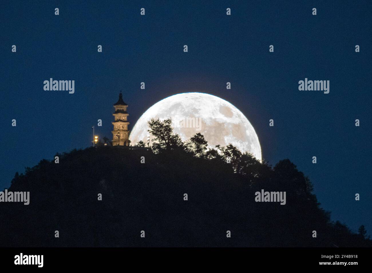 Beijing, China's Zhejiang Province. 17th Sep, 2024. The moon rises ...