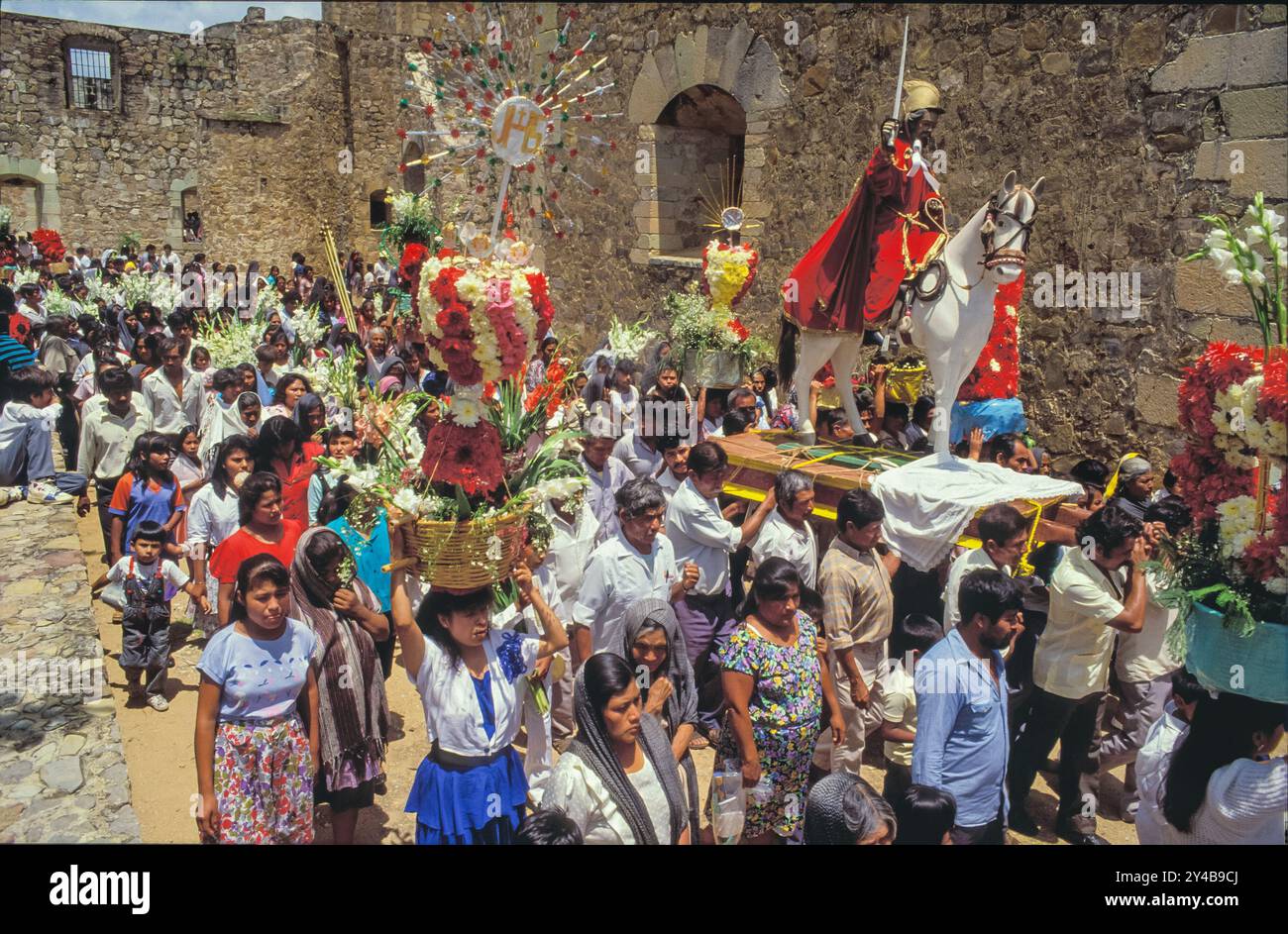 Mexico, Oaxaca. A religious Catholic procession in a rural area, with ...