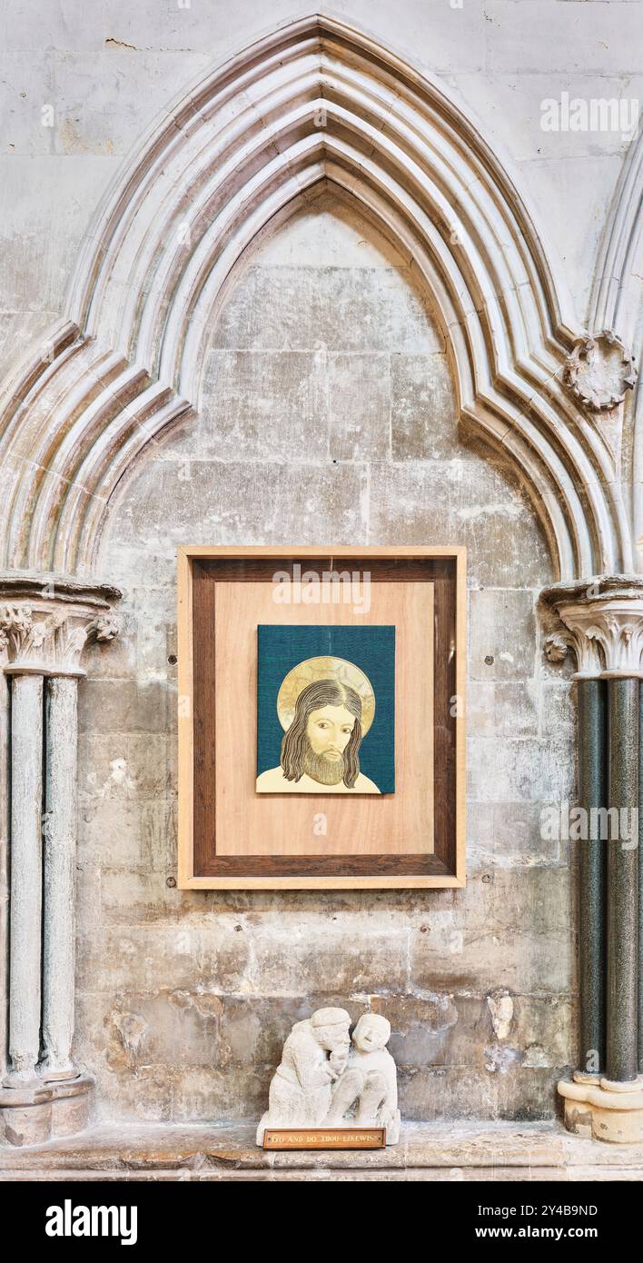 Iconic image of Jesus Christ above a sculpture of the good samaritan ...