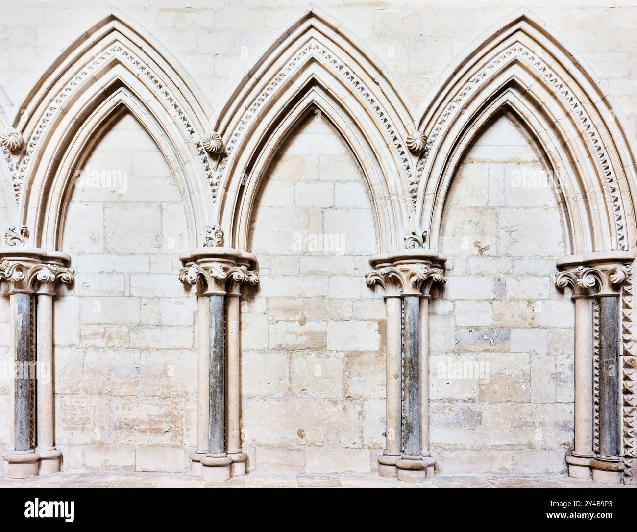 Decorative arched stonework on a wall in Lincoln cathedral, England ...