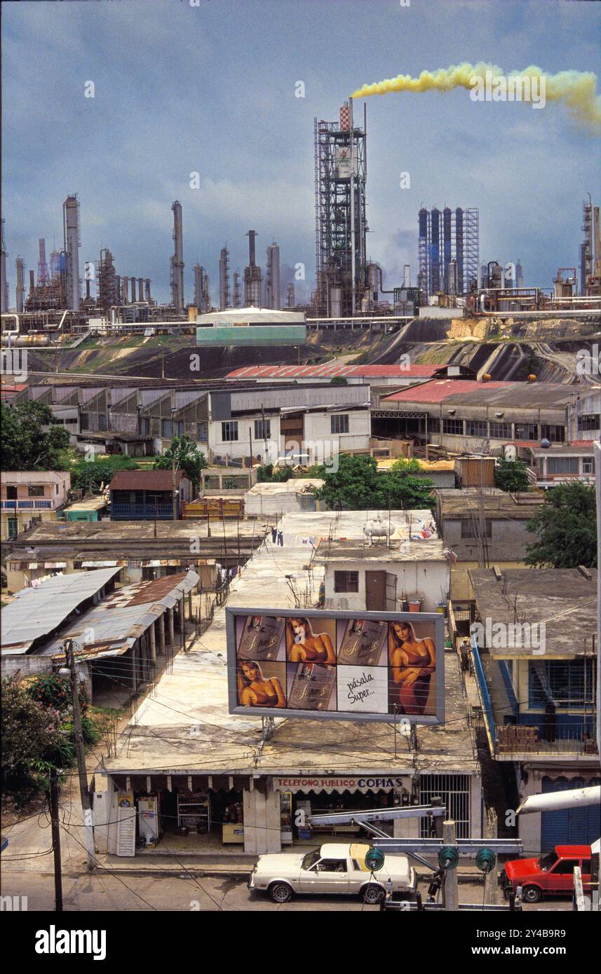 Mexico, Manititlan in Veracruz. Air polluting oil refinery next to a ...