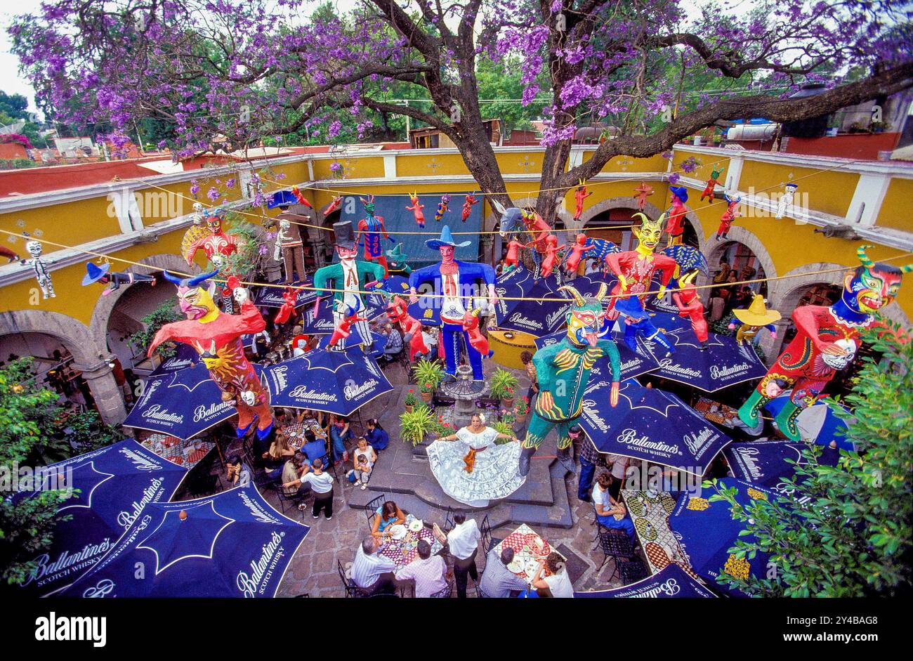 Mexico - Paper dolls, called Judas dolls, hang above a terrace in ...