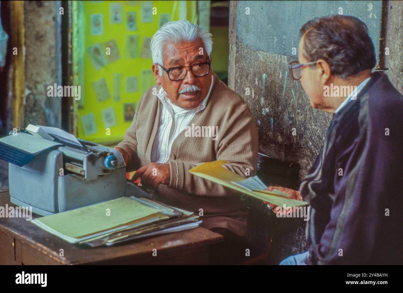 Mexico, Mexico-City - Writers fill out official forms on a typewriter and write letters for ...