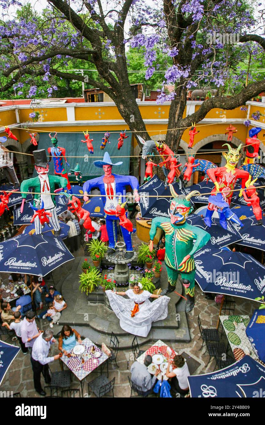 Mexico - Paper dolls, called Judas dolls, hang above a terrace in ...