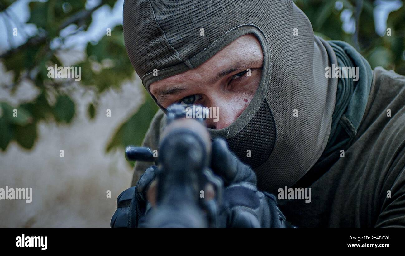 Professional soldier aims machine gun hi-res stock photography and ...