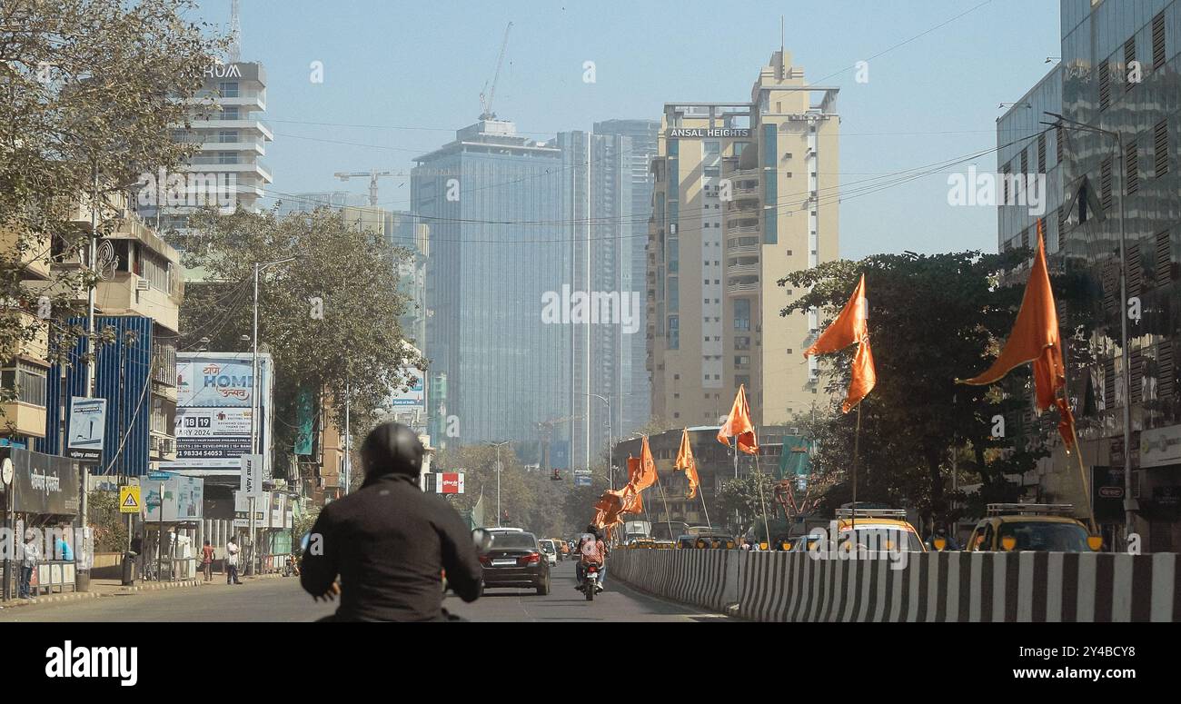 Mumbai, India. Traffic in center street. Cars, bikes, motorcycles ...