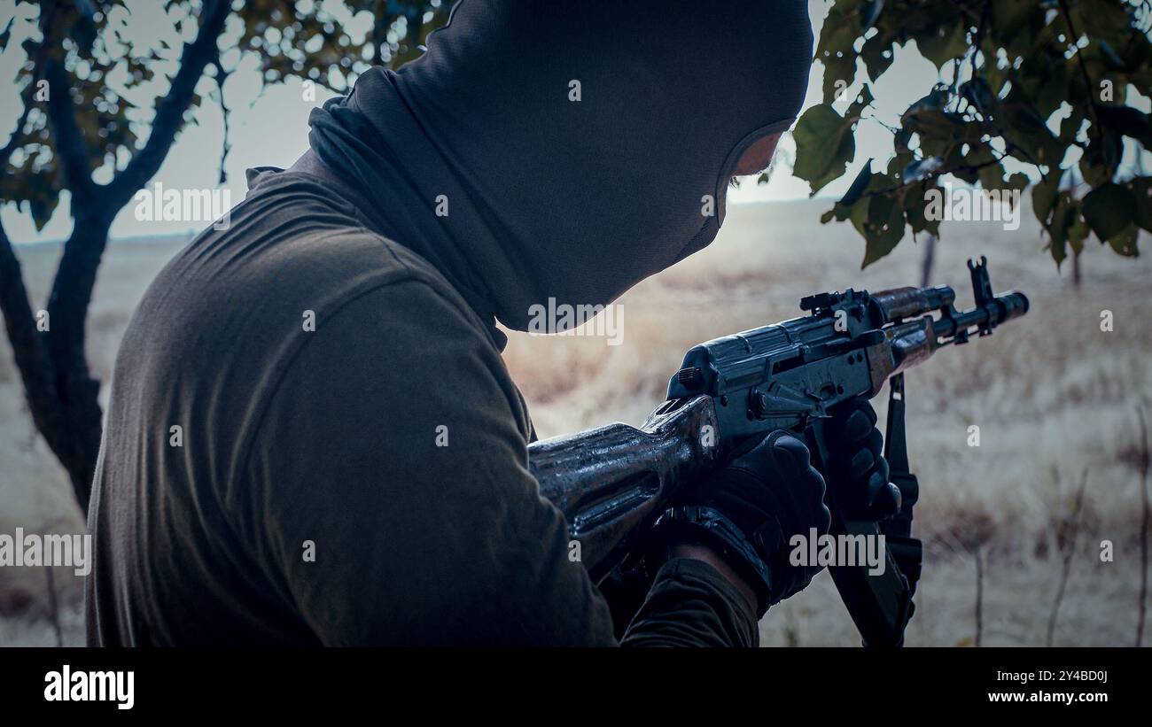 Professional soldier aims machine gun hi-res stock photography and ...