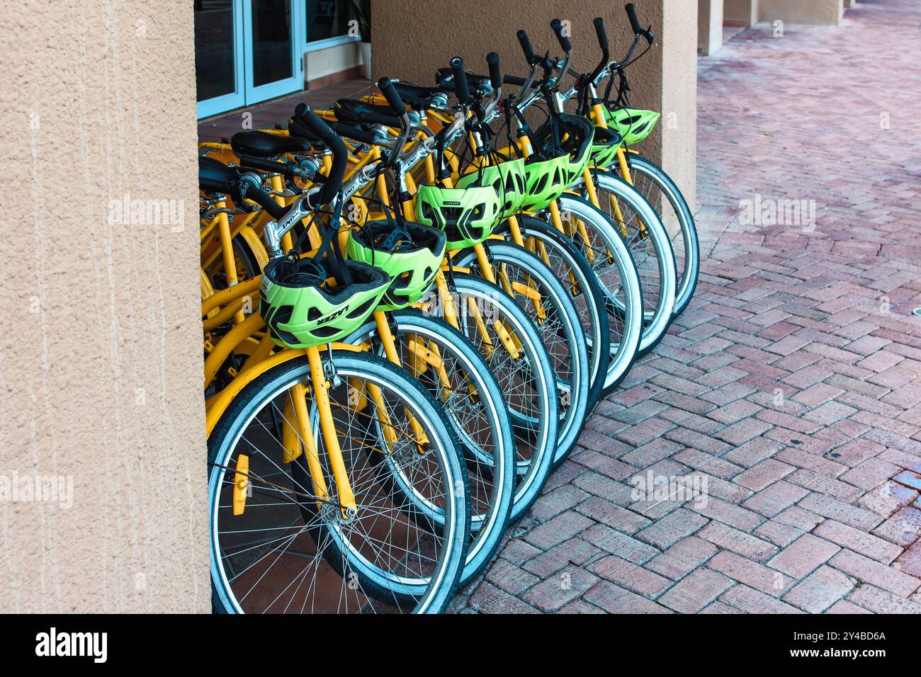 San Juan, Puerto Rico - April 20, 2017: A fleet of bike-sharing bicycles lined up on city street ...