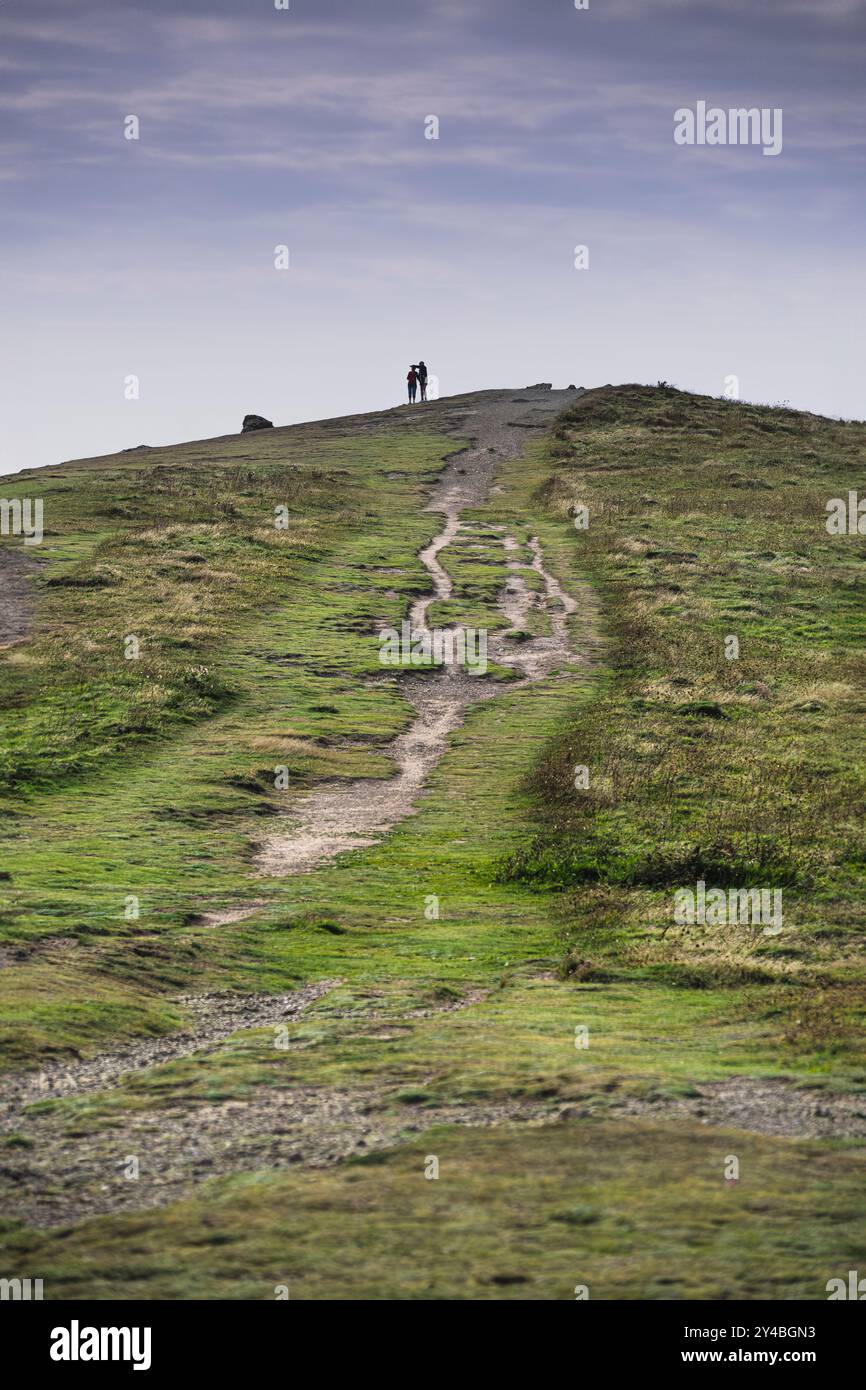Two figures standing on top of the remains of a neolithic bronze age ...