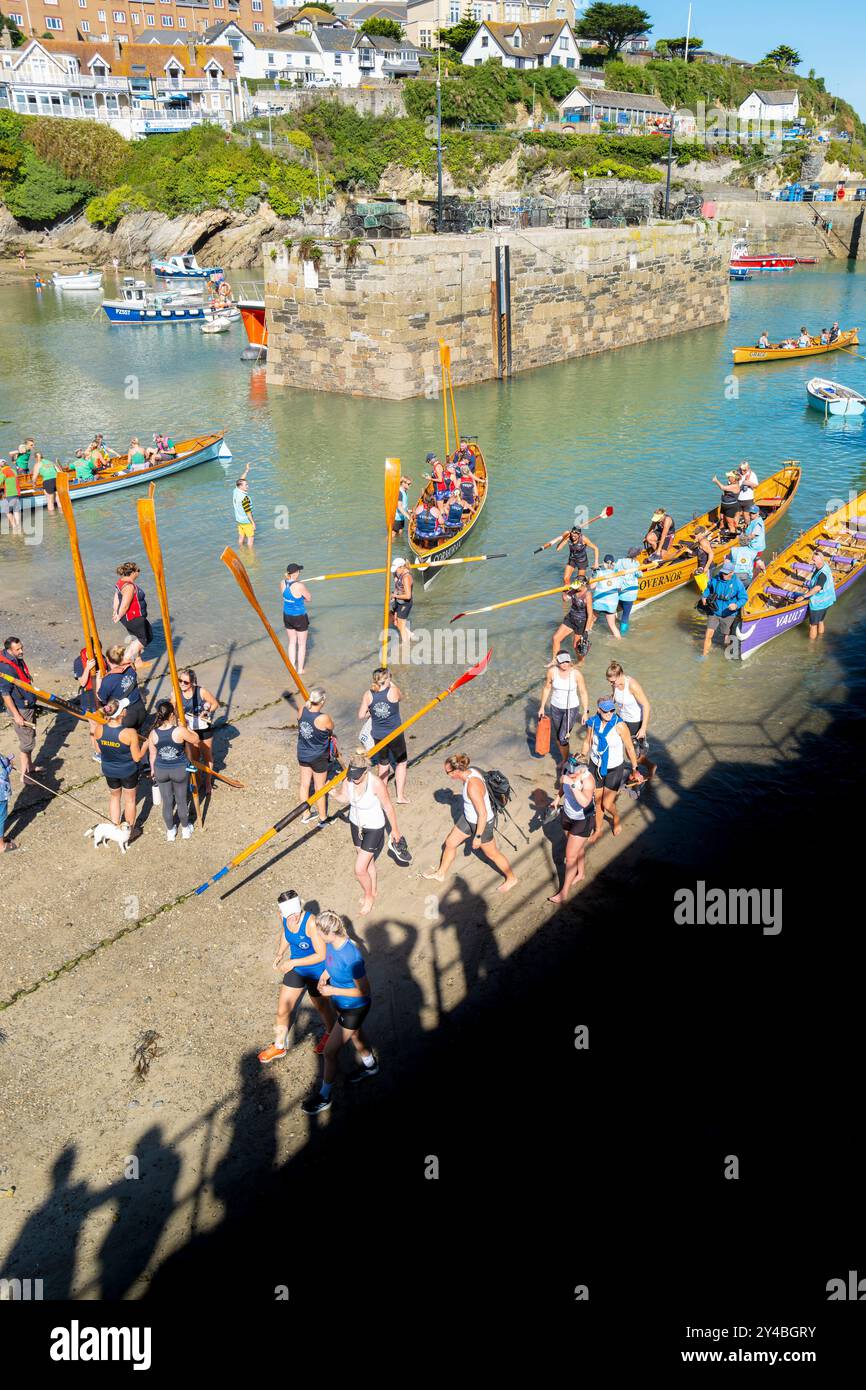 Pilot Gig crews carrying their oars waiting to board their Pilot Gigs ...