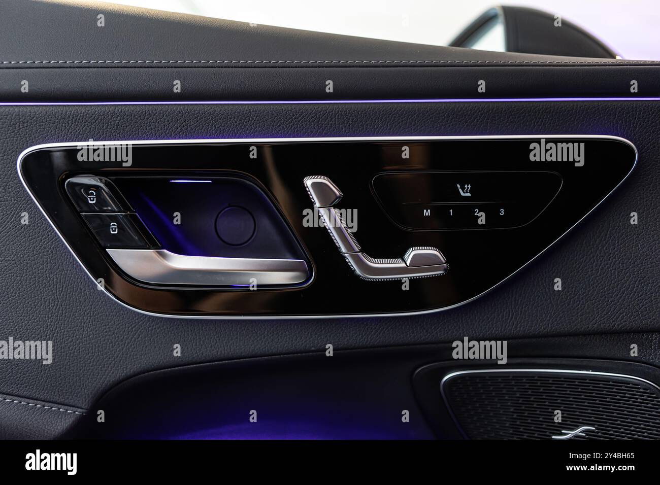 Close-up of a car door interior, showcasing luxurious leather materials ...