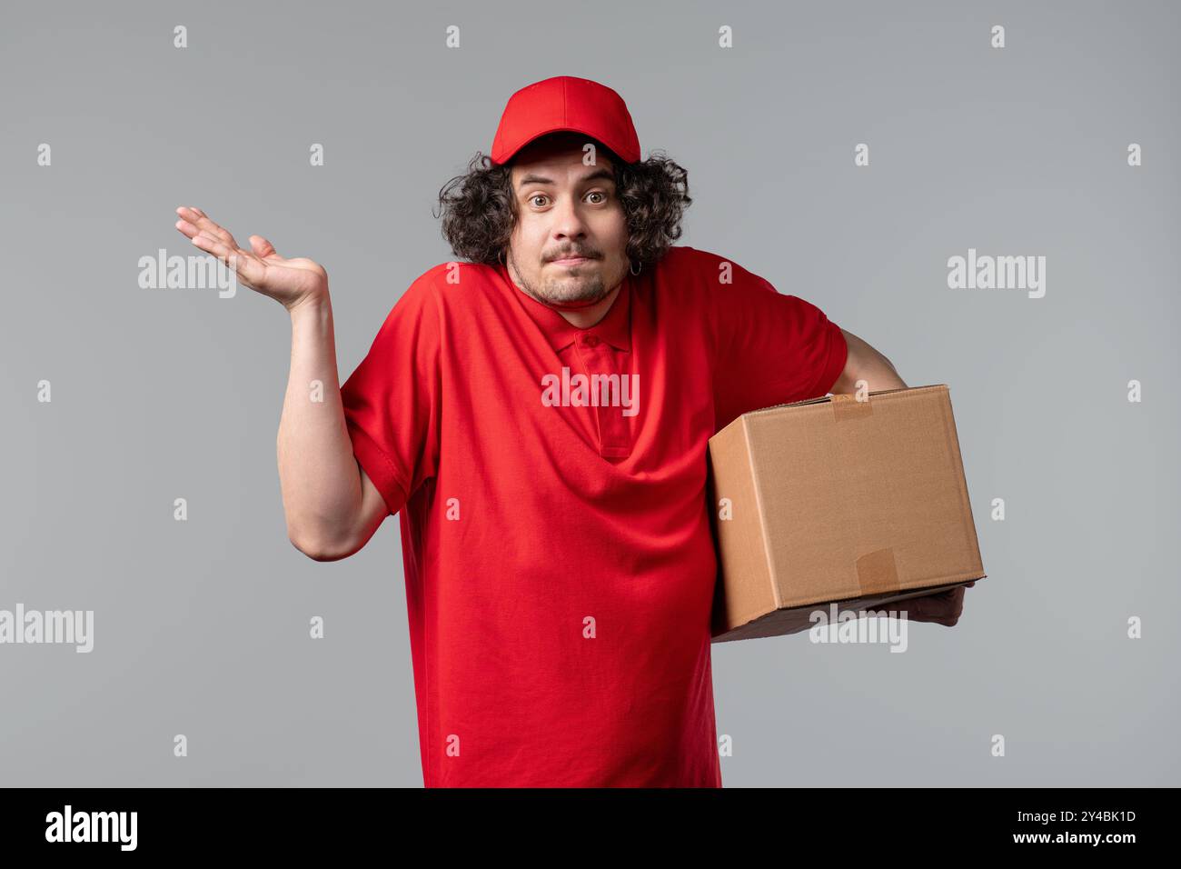 Confused postal courier man, shoulders up - can't help,makes gesture I ...