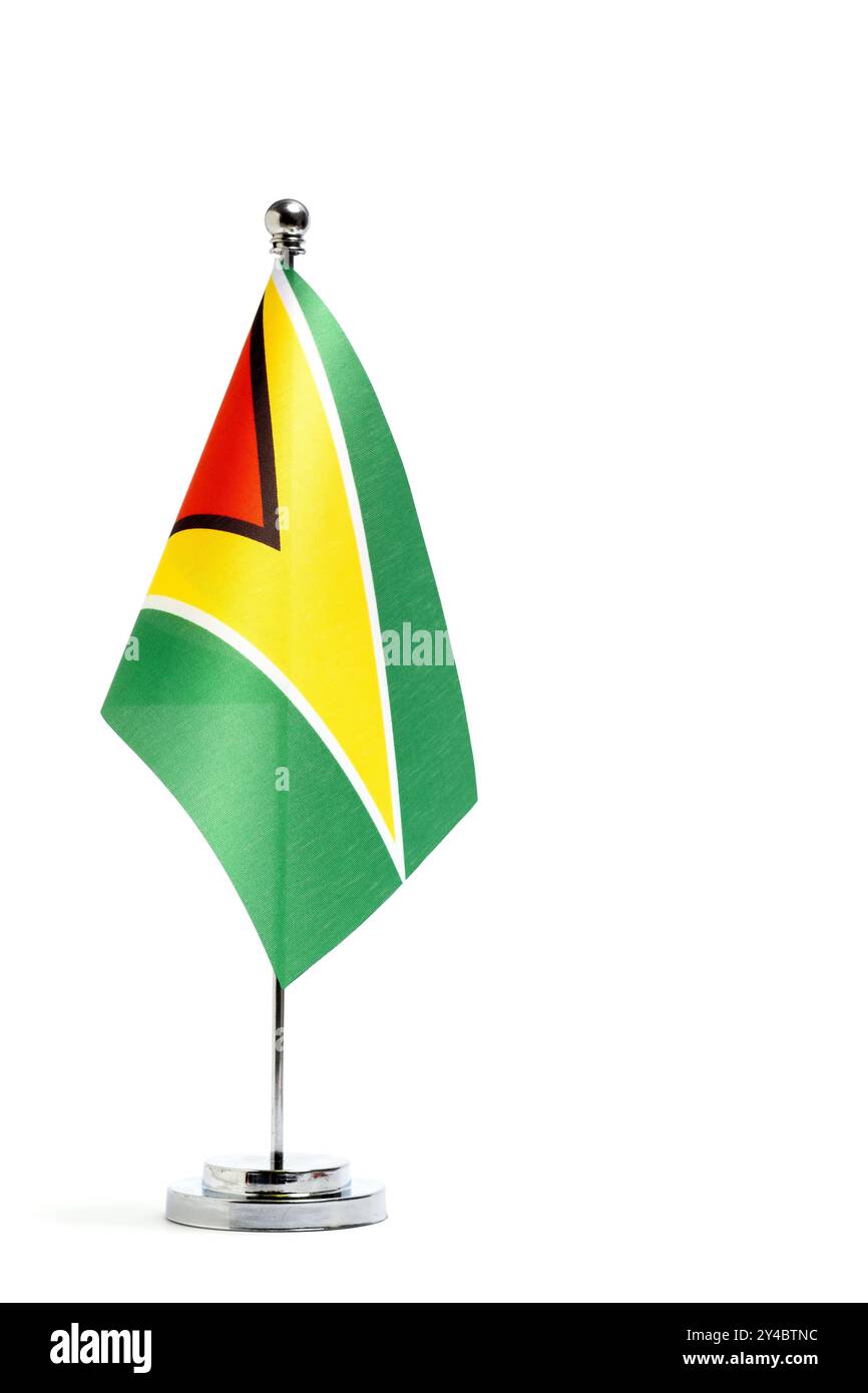 Guyana flag on stand isolated on white background Stock Photo - Alamy