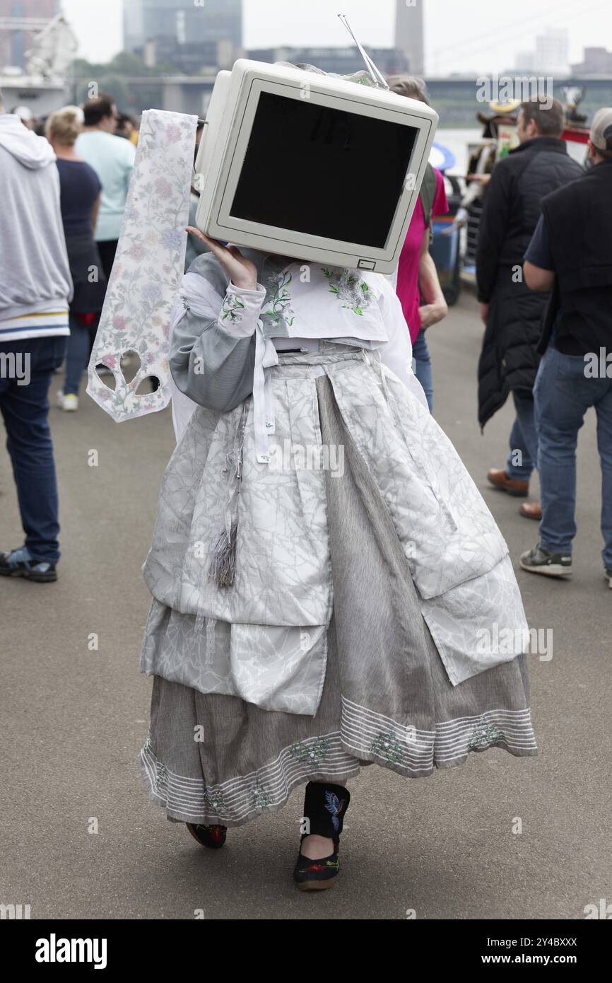 Costumed woman wearing computer screen as head, cosplay at the Japantag ...