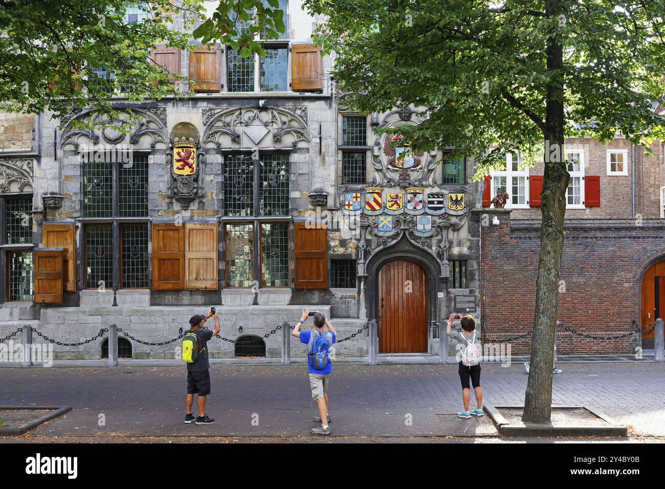 Historic city centre of Delft, tourists photograph Gemeenlandshuis van ...