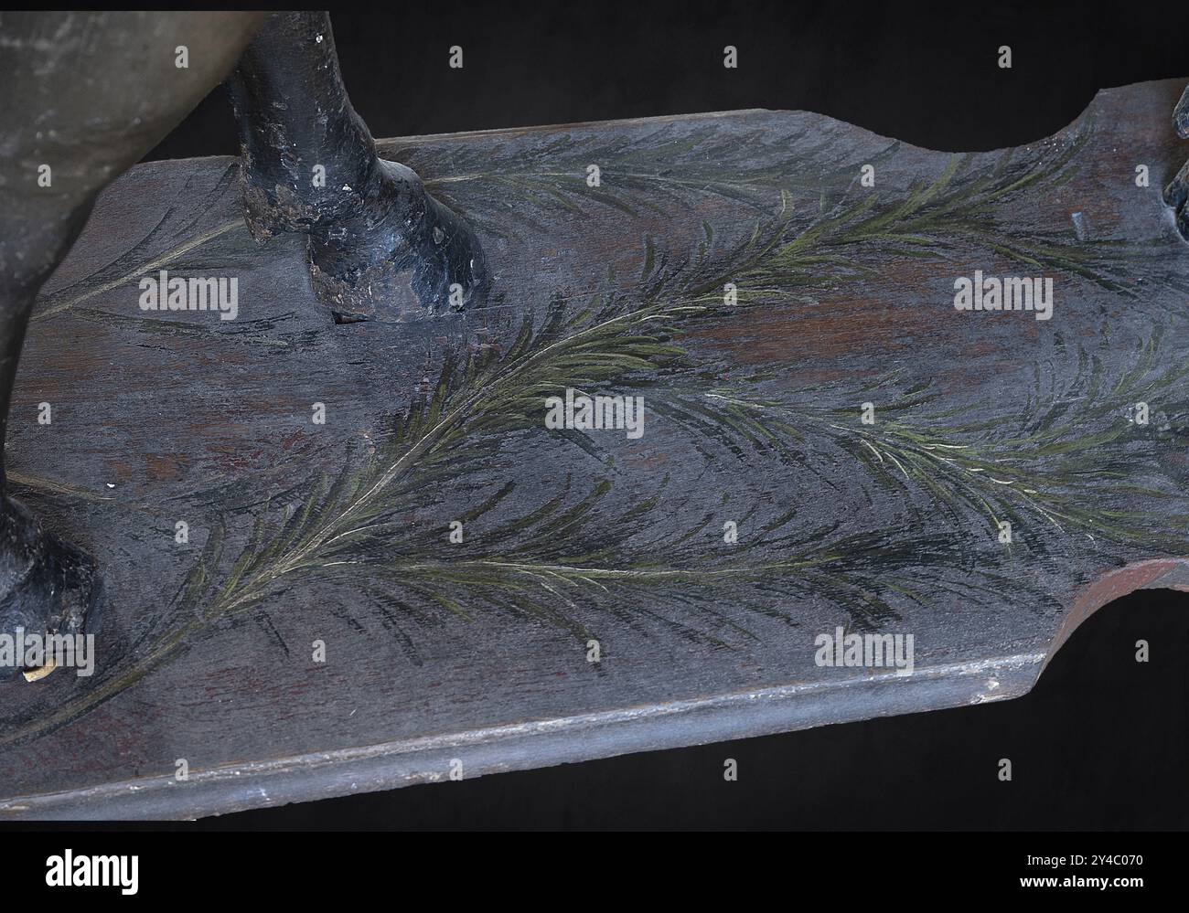 Painted palm fronds on the supporting wood of the palm tree, around ...