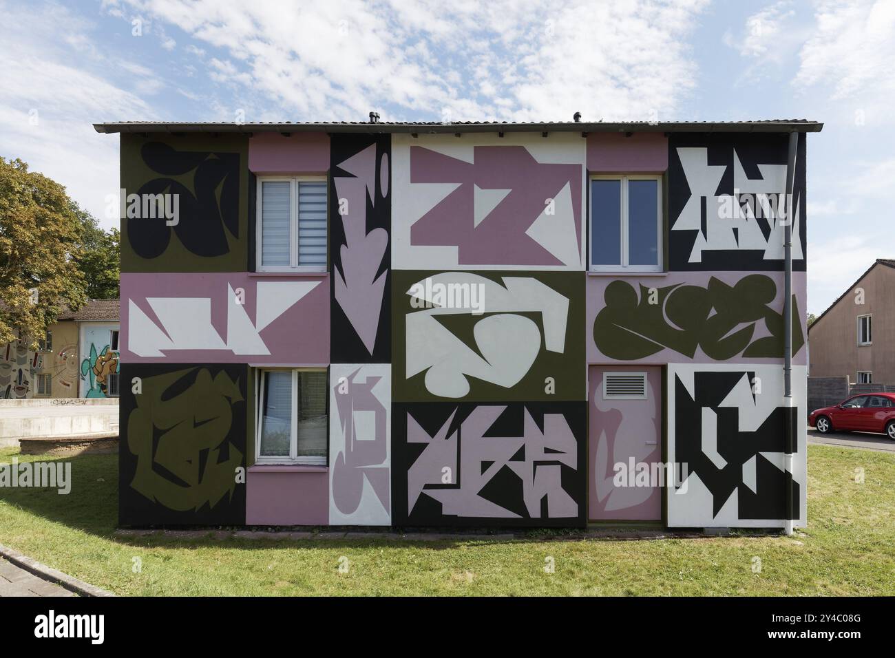 Residential building with mural by street artists Jan Herrmann and Tim ...