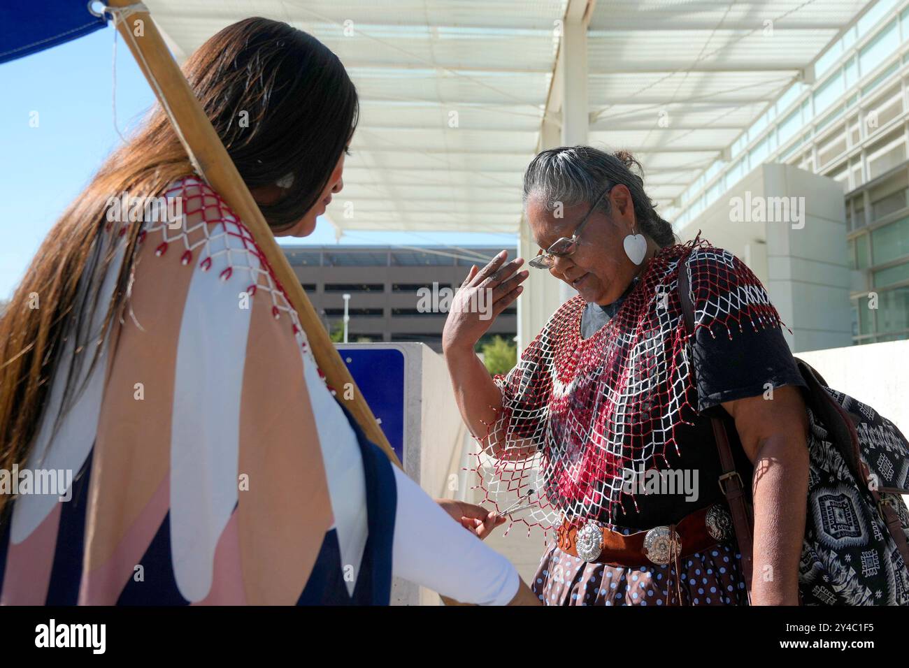 Loveena Watahomigie, left, blesses a tribal member in front of U.S ...
