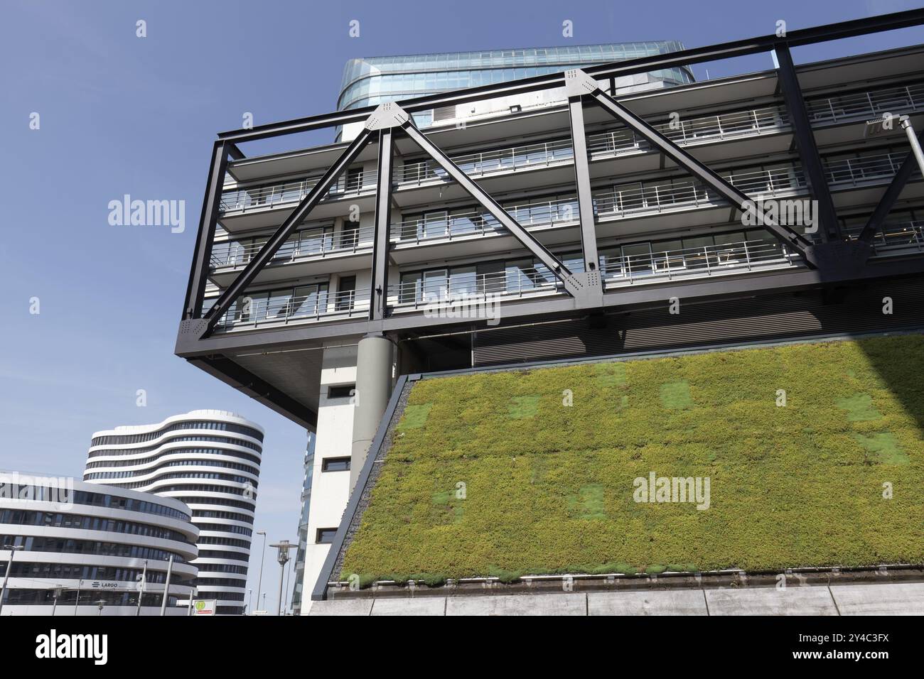 Green facade on the PEC office building, cloud bow, planting to improve ...