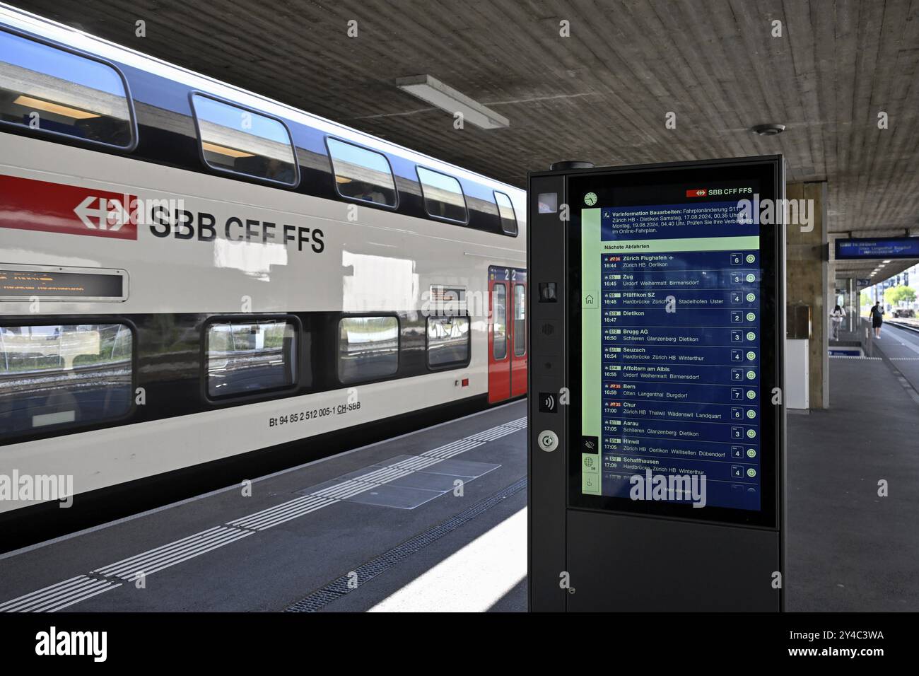 SBB timetable and passenger train Stock Photo - Alamy