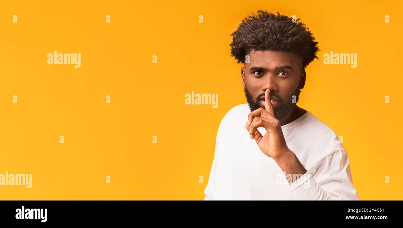 Silent afro guy making hi-res stock photography and images - Alamy
