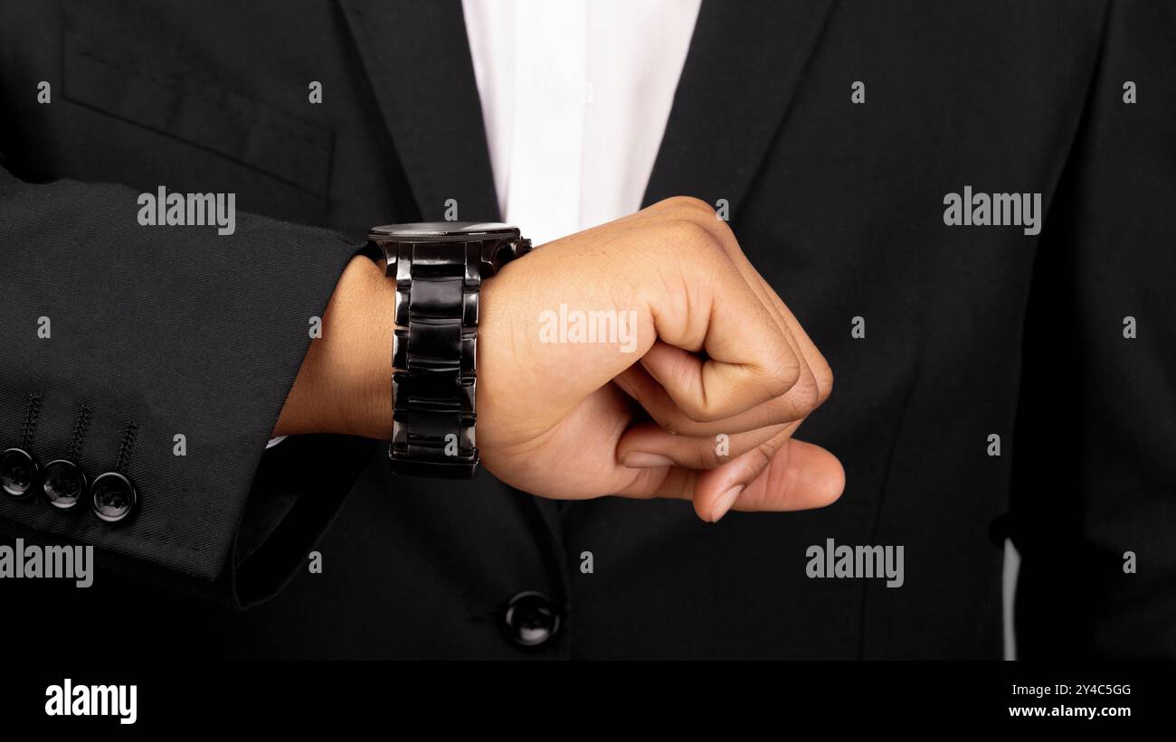 Unrecognizable man checking time on his wristwatch Stock Photo - Alamy