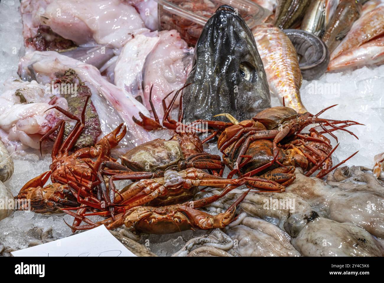 Crabs and fish for sale at a market in Barcelona, Spain, Europe Stock ...
