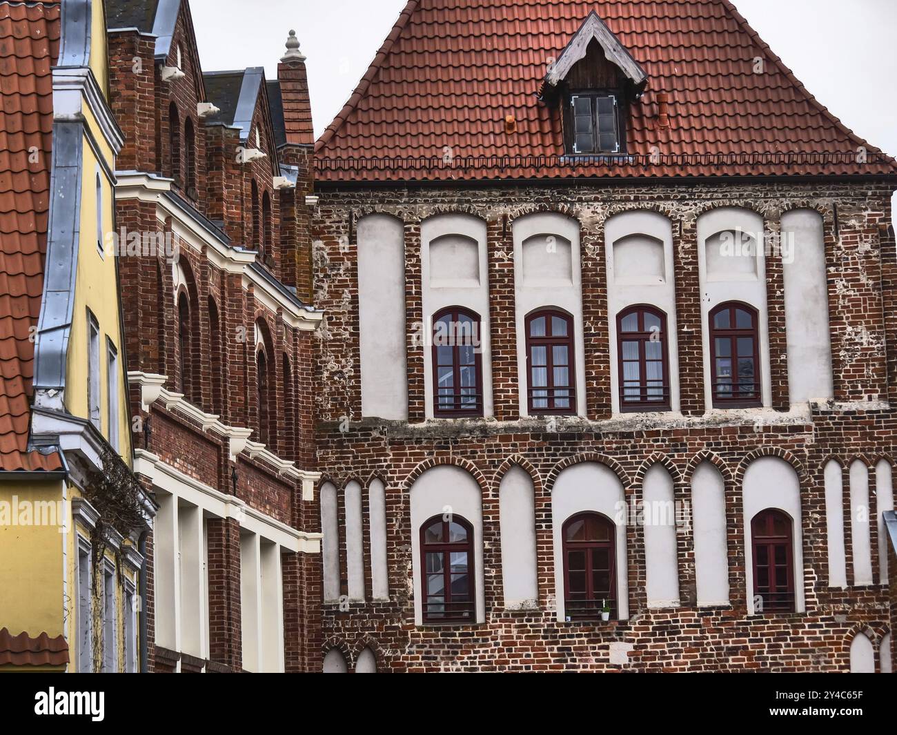 Historic building with red tiled roof, numerous windows and medieval ...