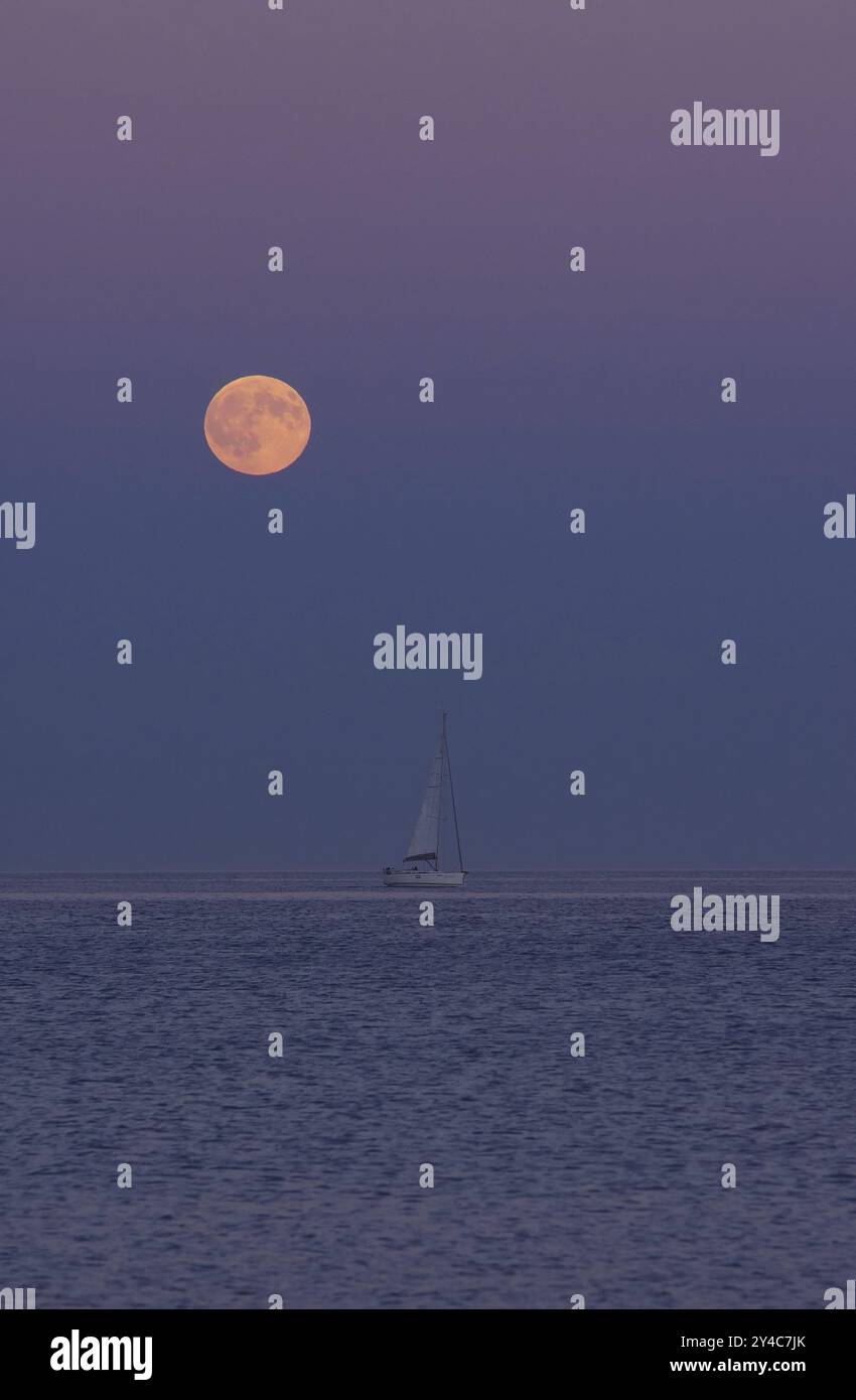 Moonrise over the sea at Stock Photo - Alamy