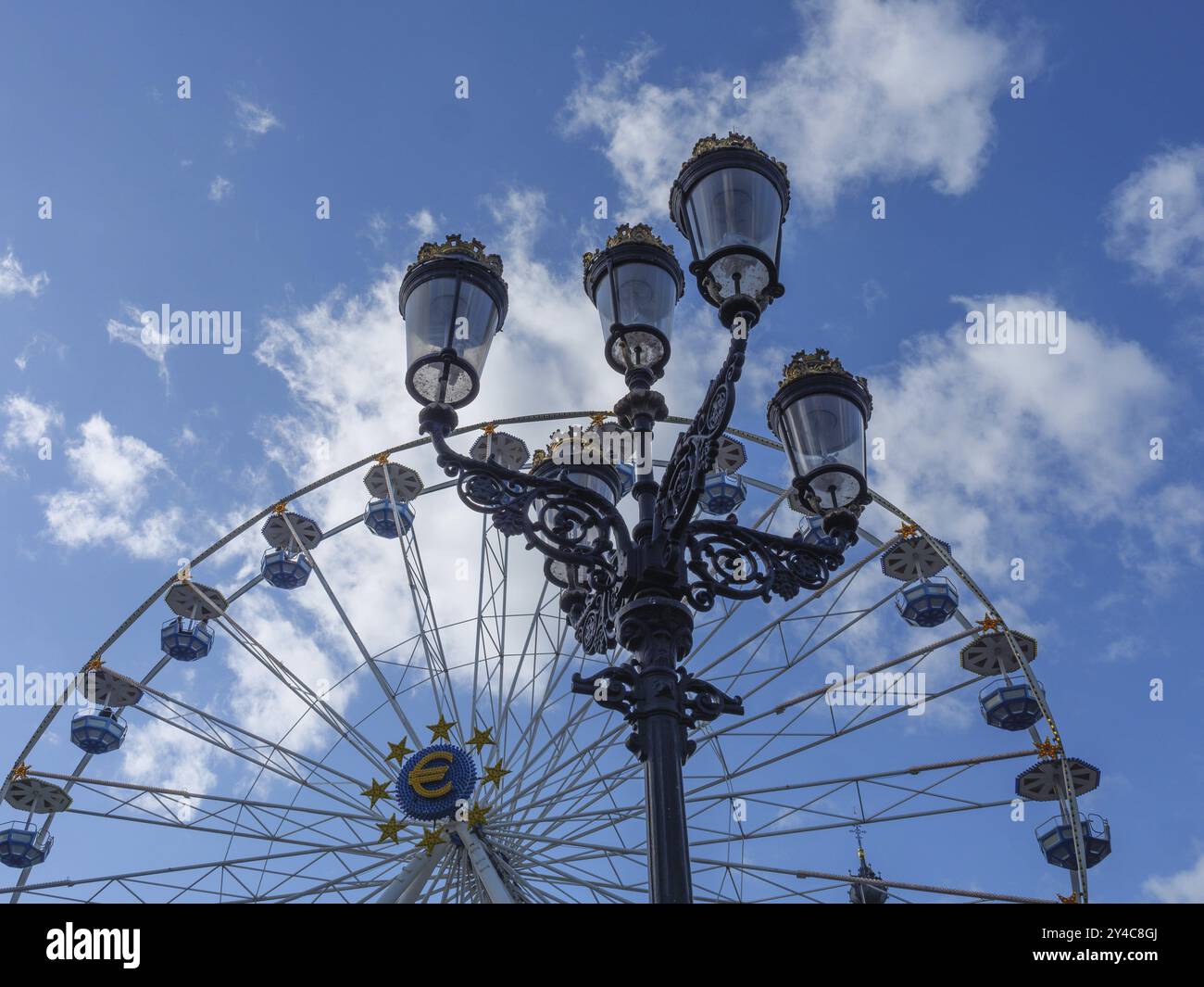 Amusement park scene with a Ferris wheel and a lantern in front of a ...