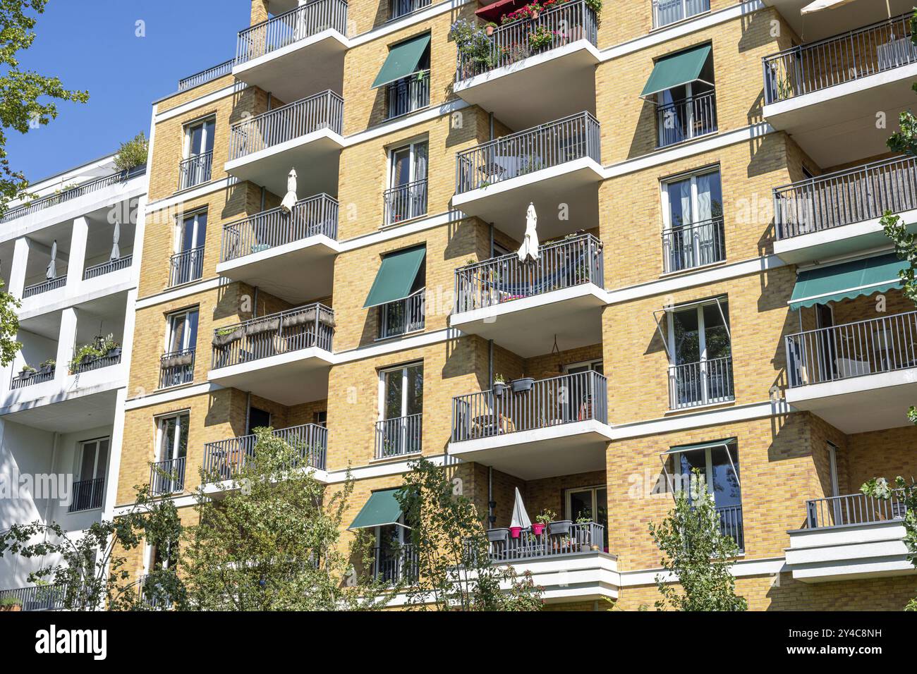 Modern apartment block surrounded by trees, seen in Berlin, Germany ...