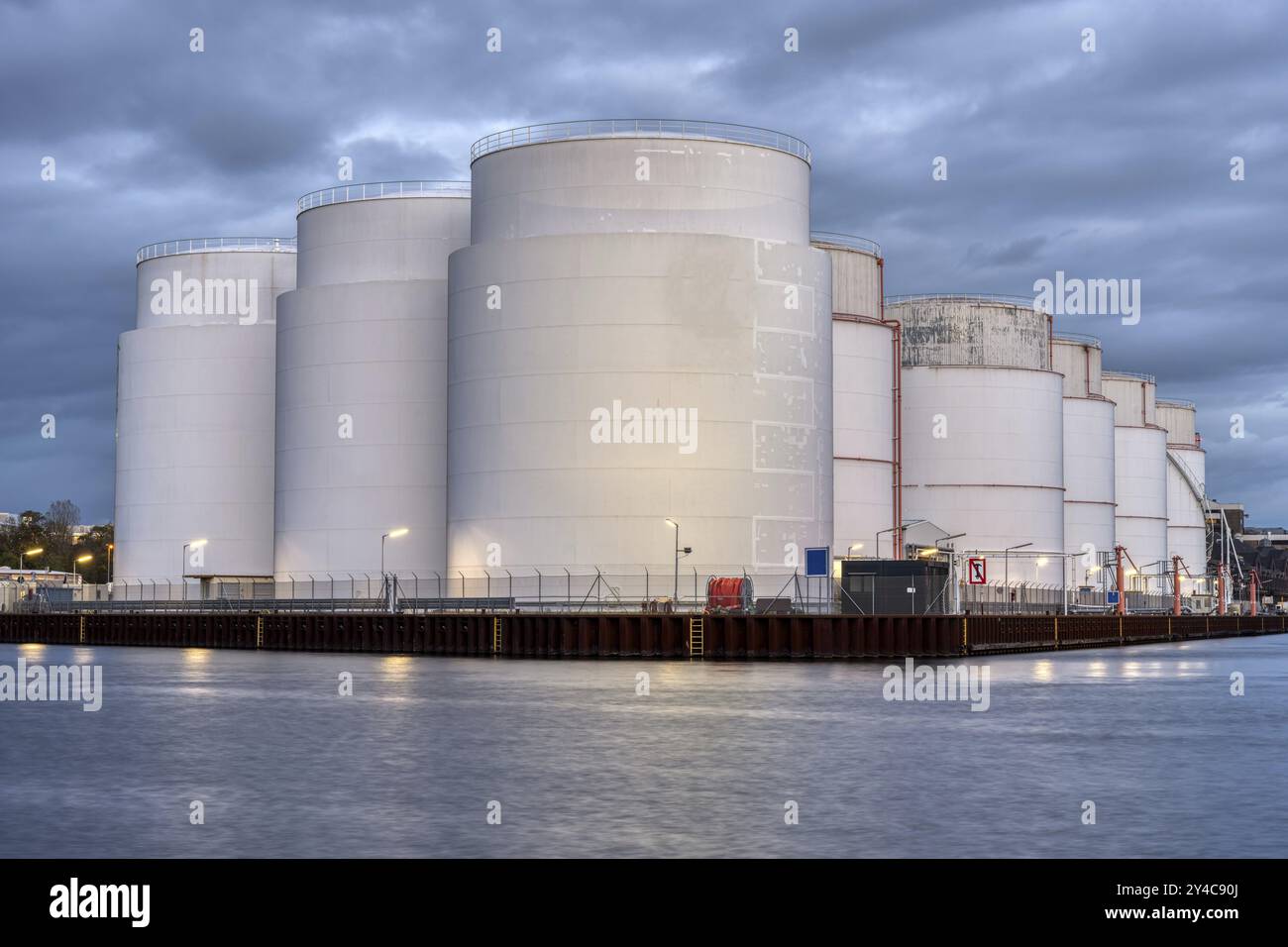 Storage tanks for fossil fuels at dusk, seen in Berlin Stock Photo - Alamy