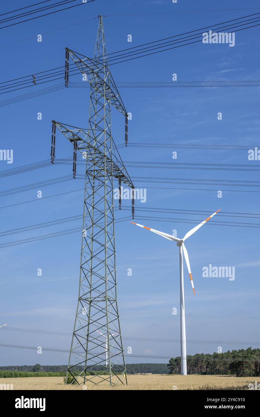 Electricity pylon, wind turbine and power cable seen in Germany Stock ...