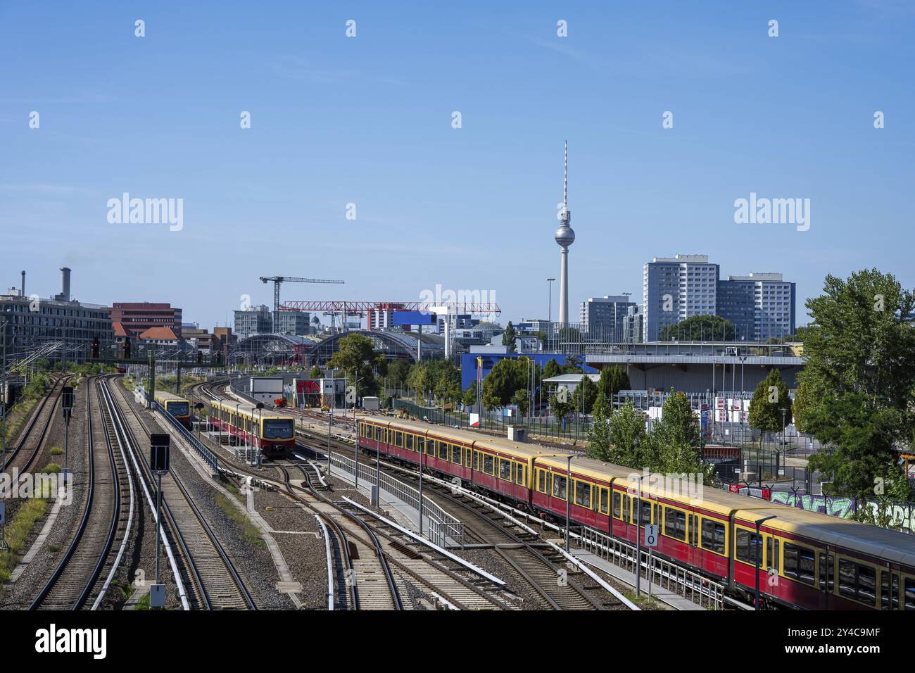 Local trains in Berlin, Germany, with the famous television tower in ...
