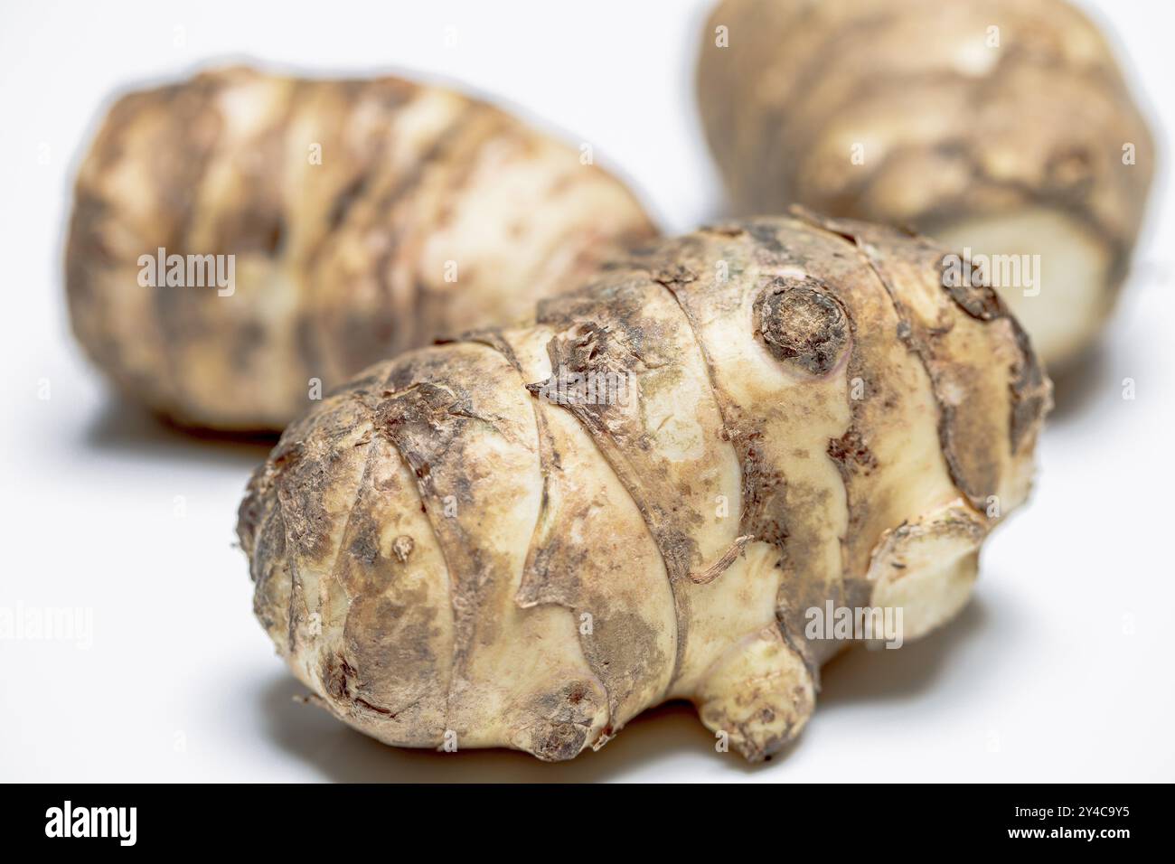 Jerusalem artichoke root tubers on a white background Stock Photo - Alamy