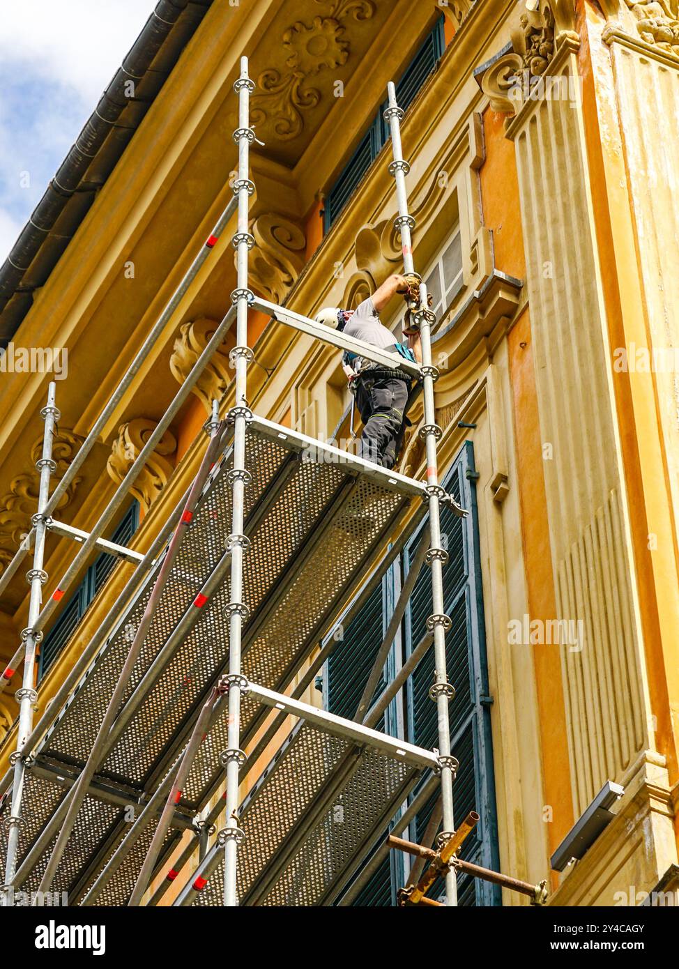 Modern metal tube prefabricated scaffolding installation around the ...