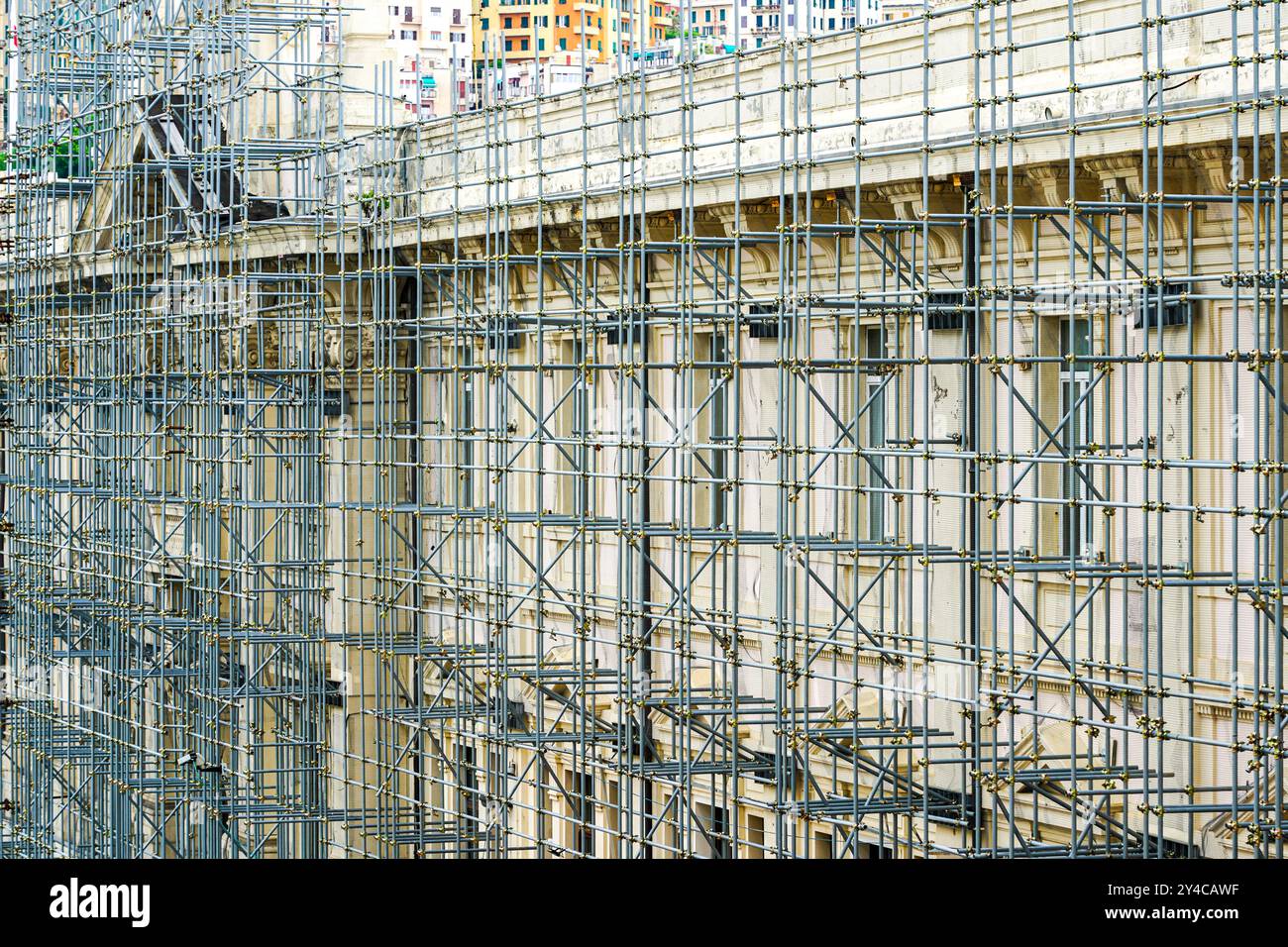 Assembly modern metal tube scaffolding around house facade before ...