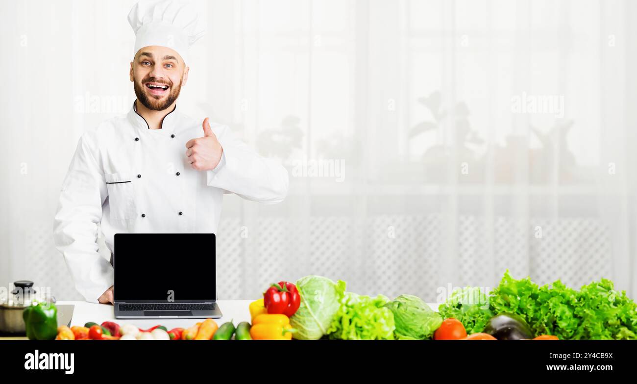 Chef Showing Laptop Blank Screen Gesturing Thumbs-Up Standing In ...