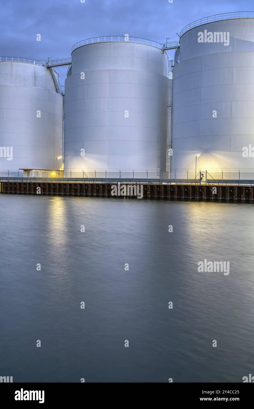 Large oil tanks seen at dusk in Berlin Stock Photo - Alamy