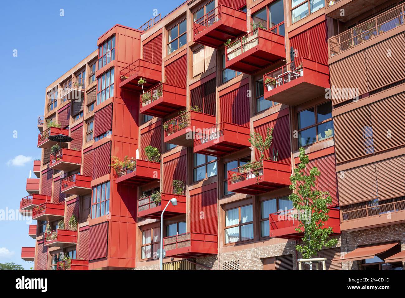 Red apartment block with balconies, seen in Berlin, Germany, Europe ...