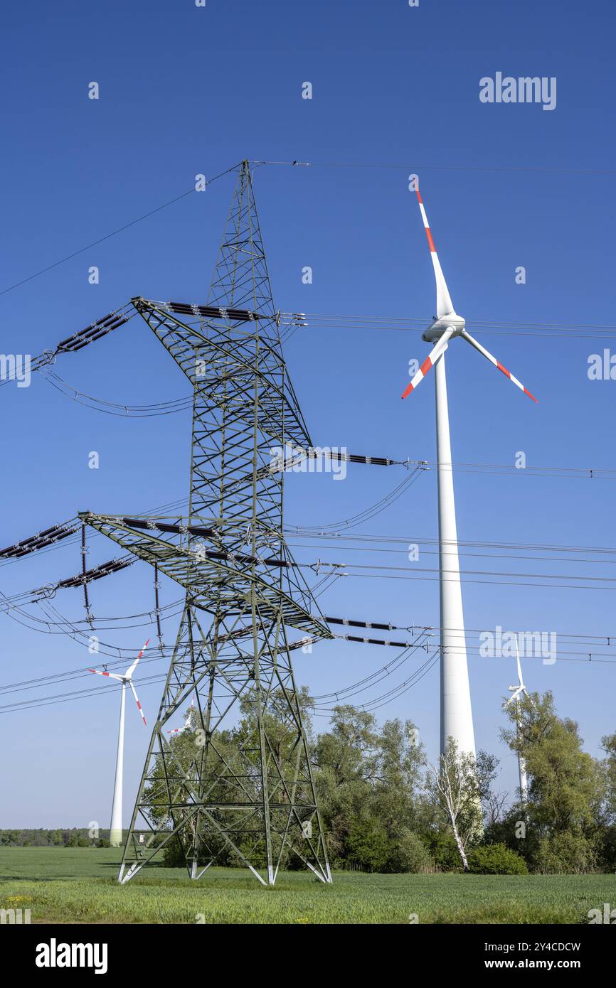 Wind turbine and electricity pylon in Germany Stock Photo - Alamy
