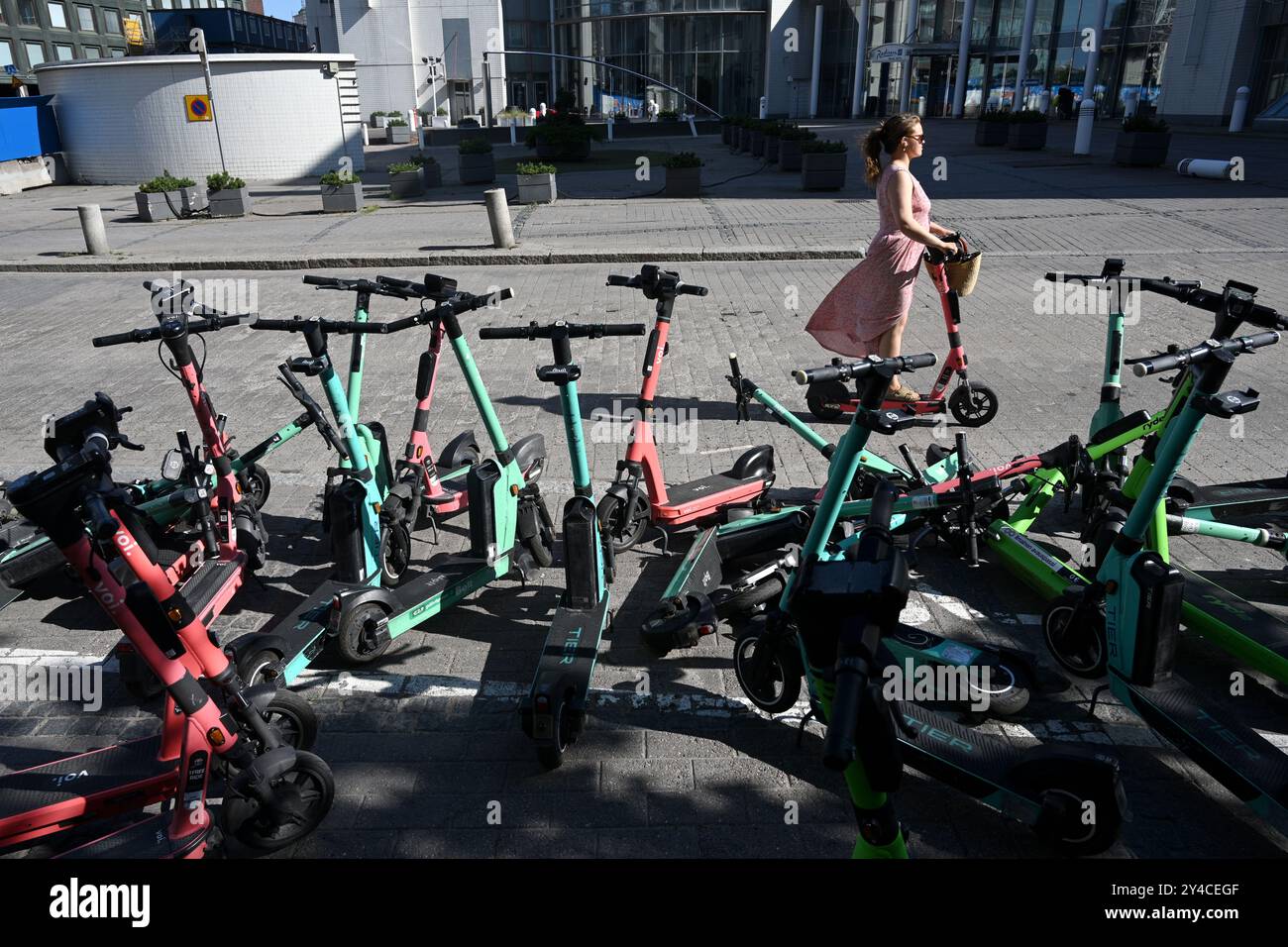 Girl ride on electrical scooter hi-res stock photography and images - Alamy
