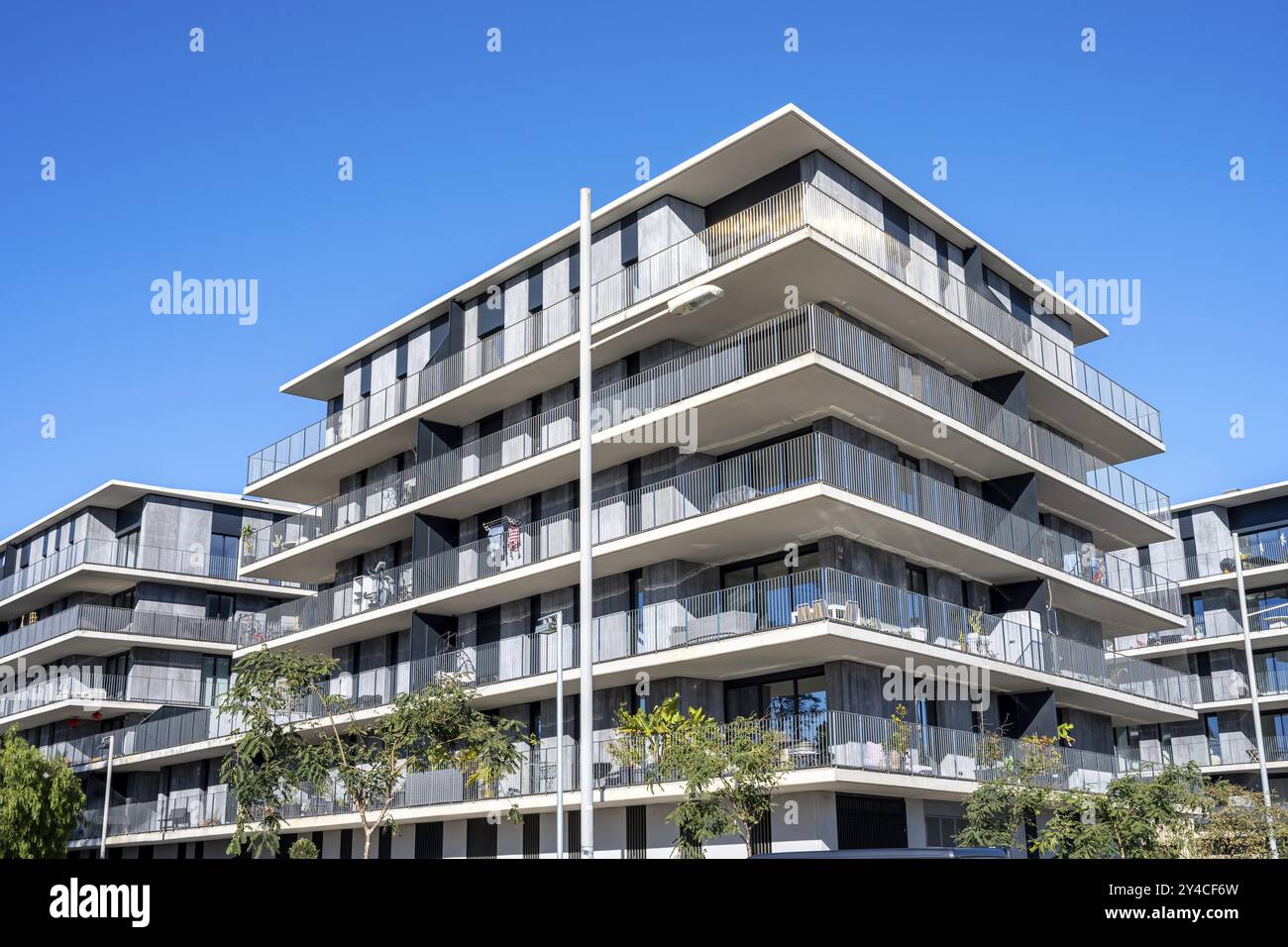 Modern grey apartment buildings with wrap-around balconies in Barcelona ...
