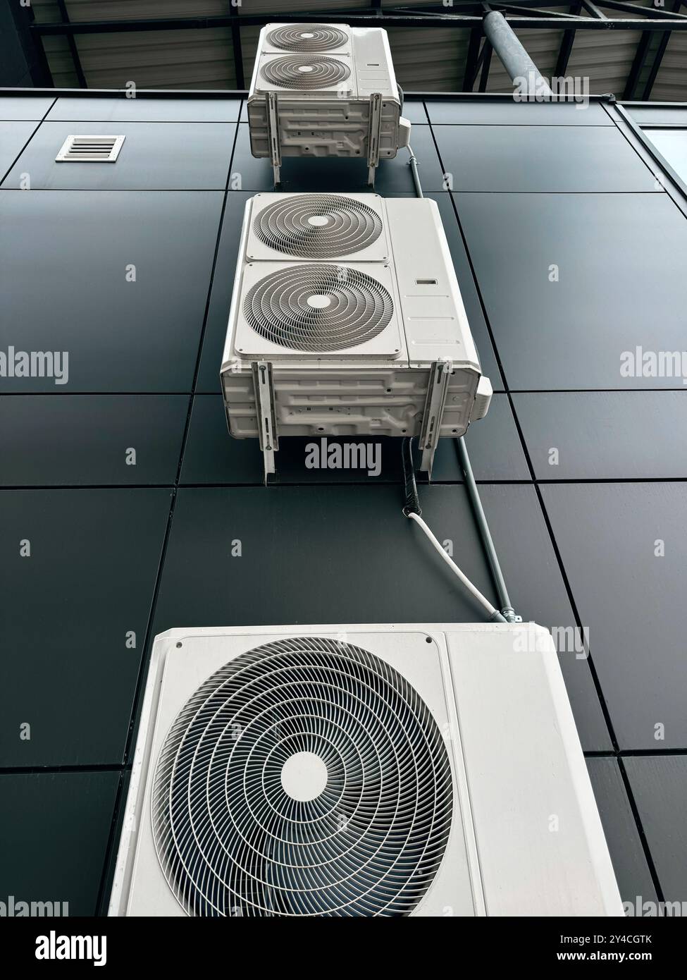 Commercial building with external air conditioning units and metal ...