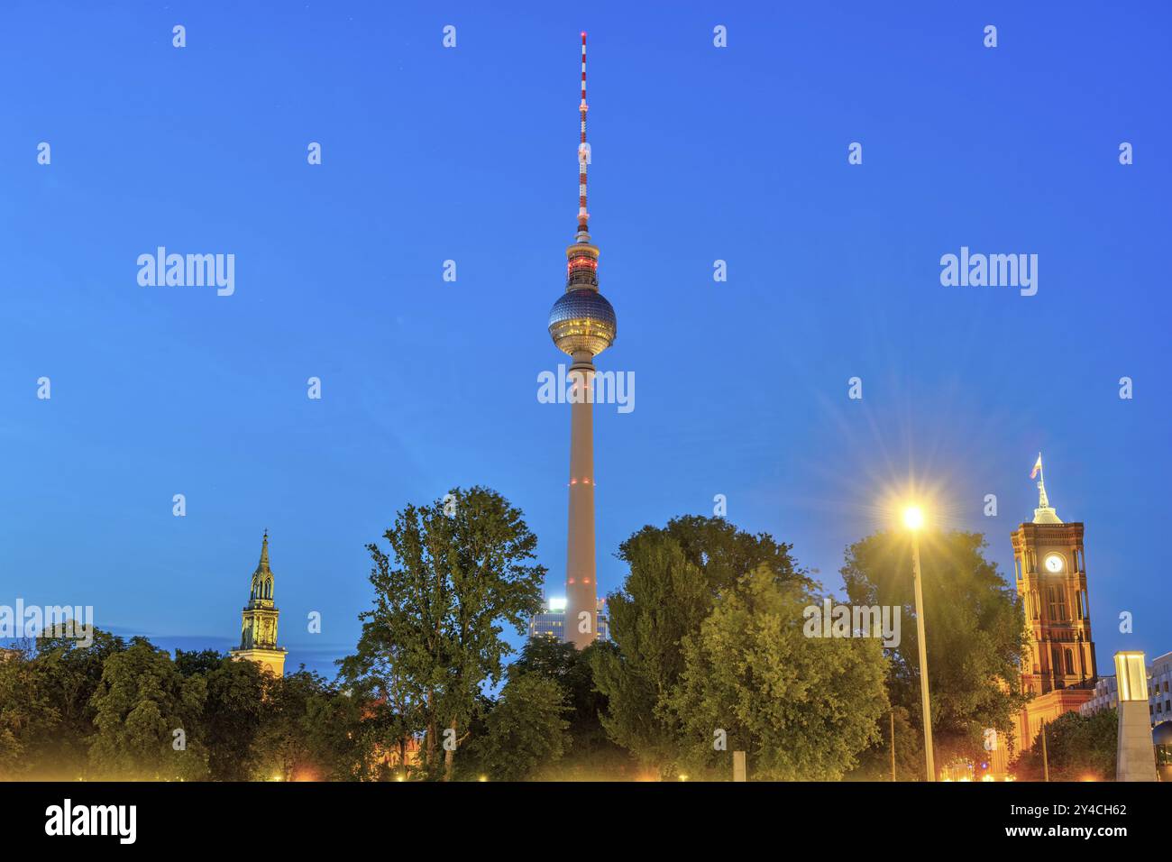 The famous television tower with the towers of St Mary's Church and the ...