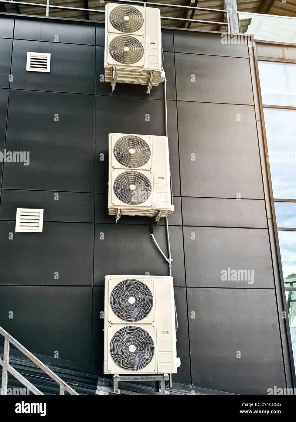 Steel-framed industrial building with rooftop air conditioning units ...