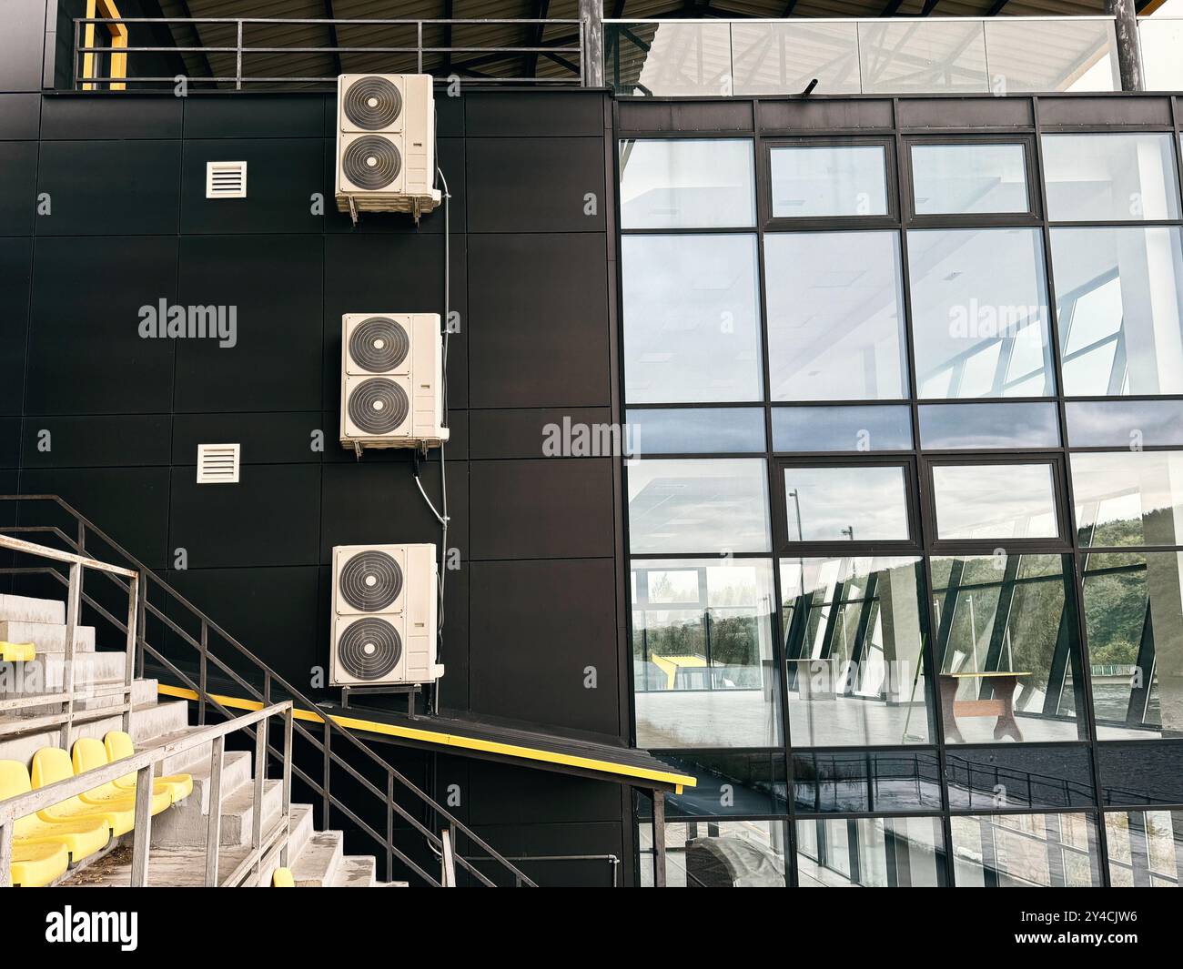 Sports building with air conditioners on the wall Stock Photo - Alamy