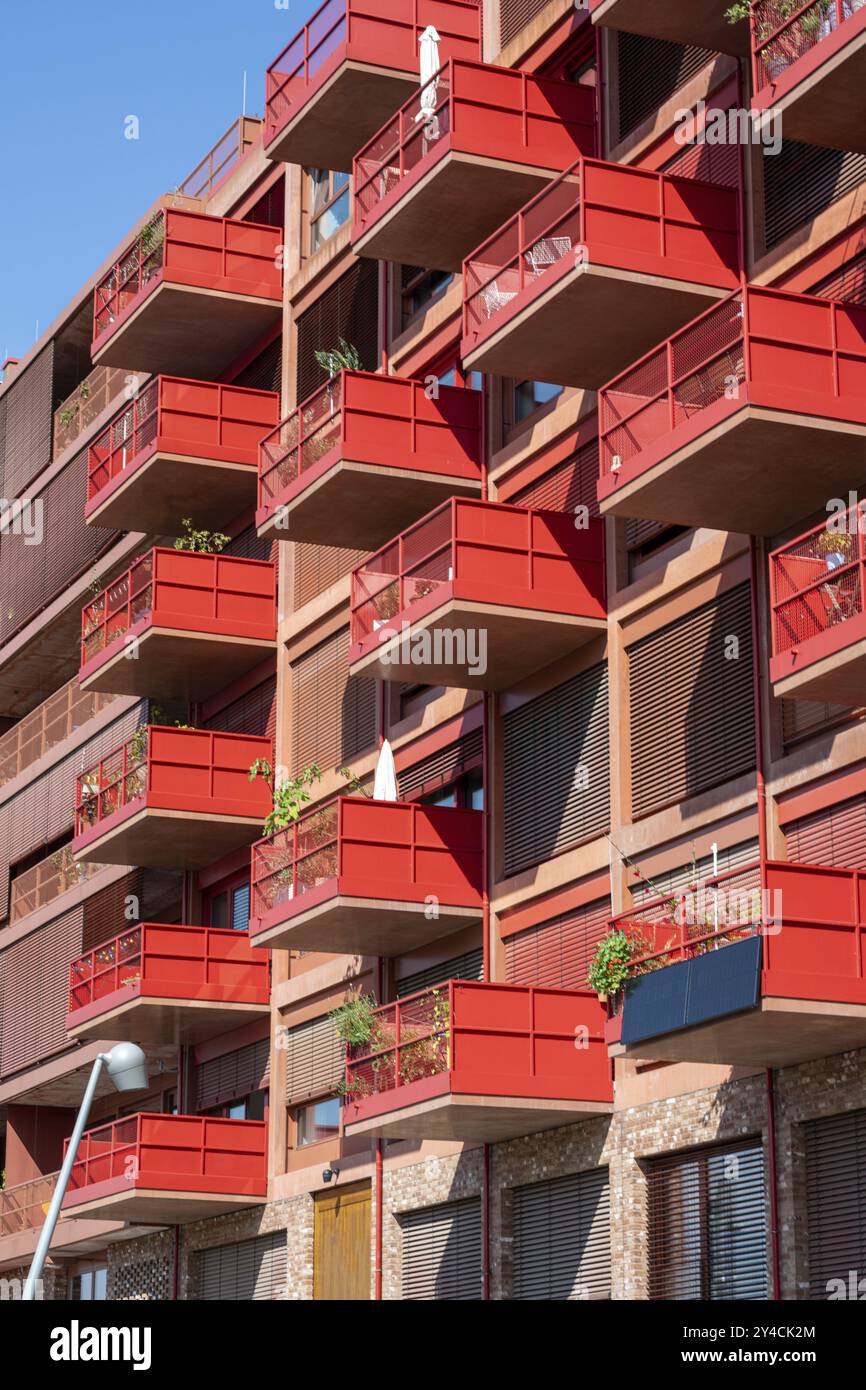 Red apartment block with large balconies, seen in Berlin, Germany ...